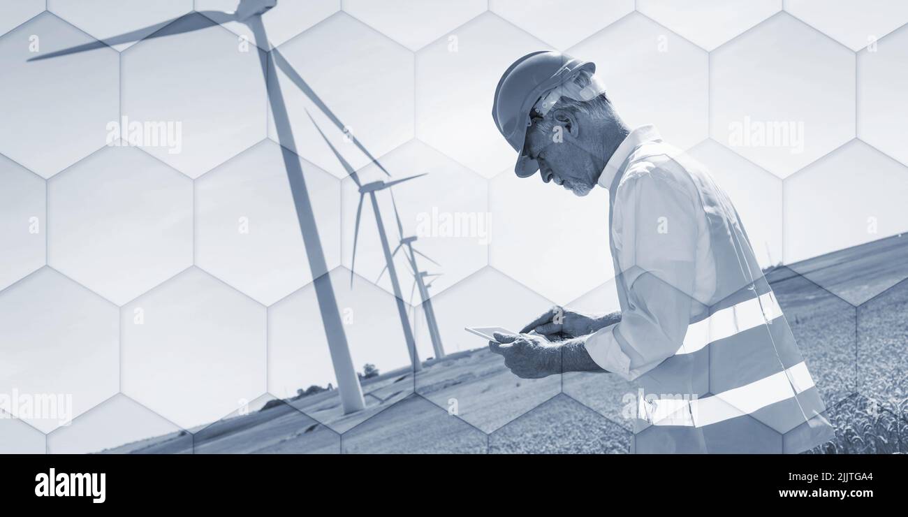 Electrical engineer using digital tablet for wind turbine inspection ...