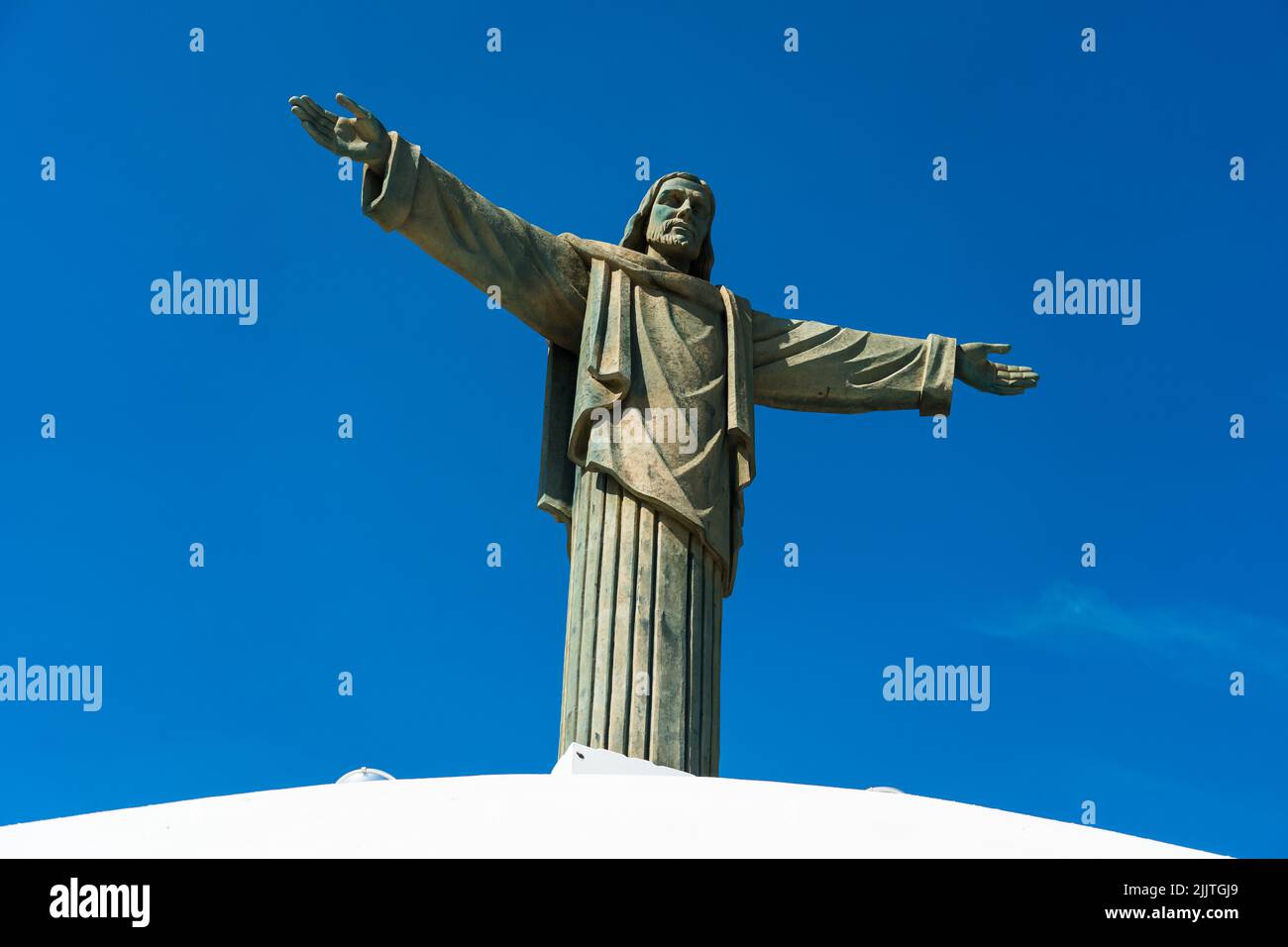 A closeup of Jesus statue at the top of Mount Isabel de Torres in ...