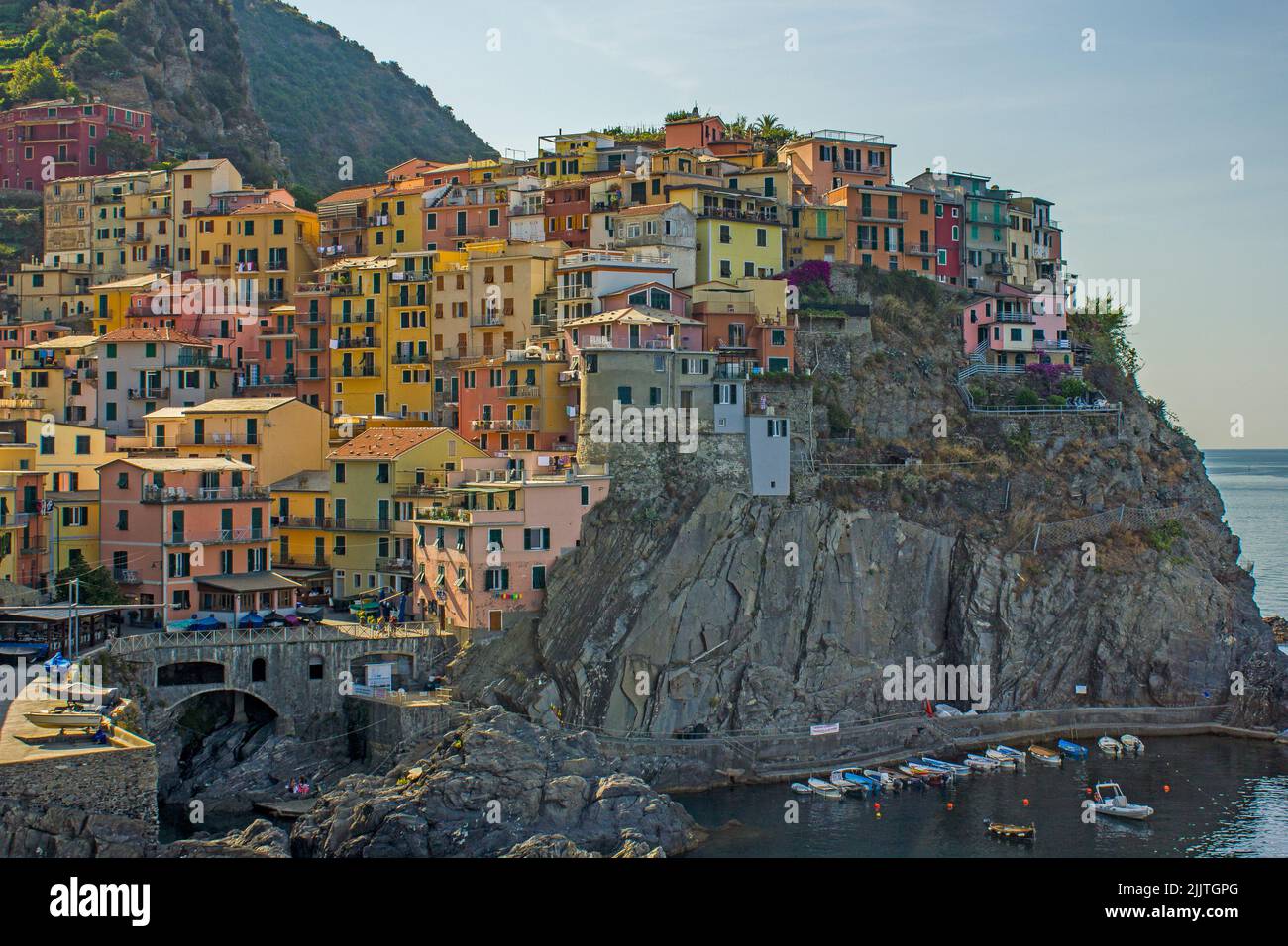 An aerial view of cityscape Manarola surrounded by colorful buildings ...