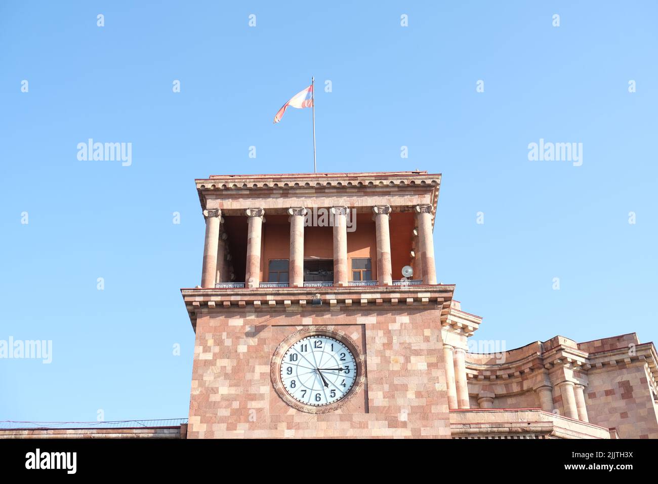 A beautiful view of Yerevan republic square clock center against blue ...