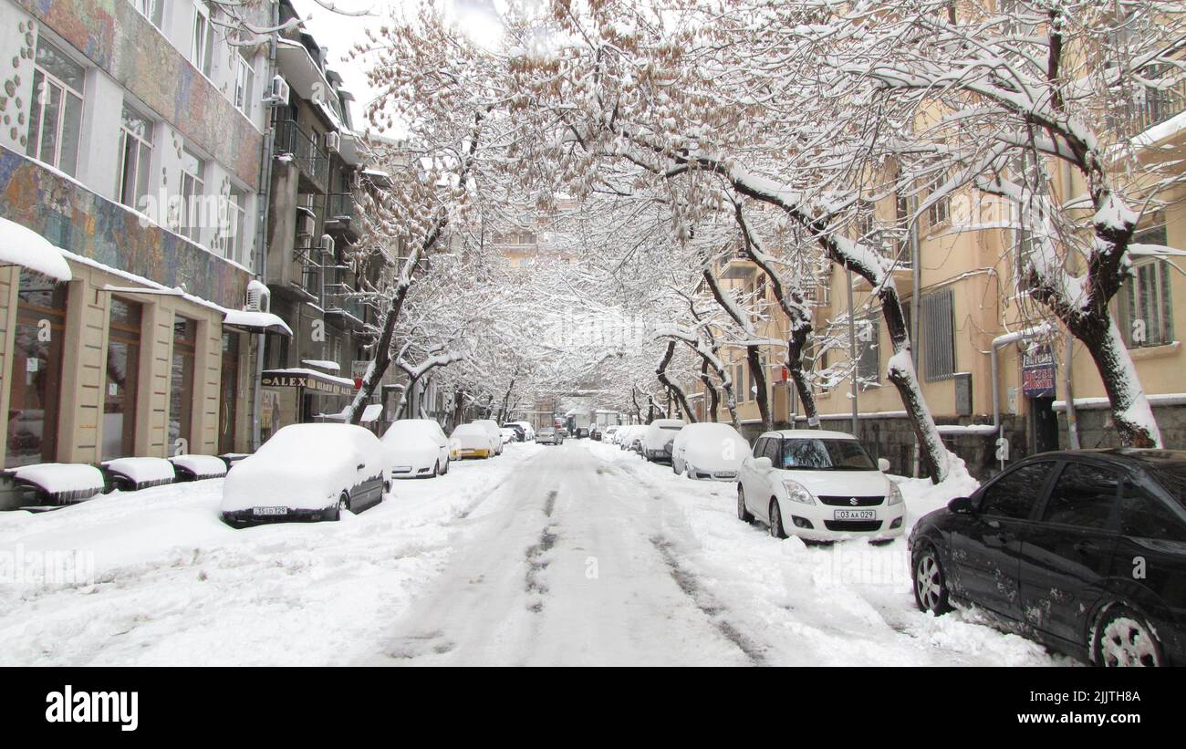 A beautiful shot of Yerevan streets covered with snow during winter ...