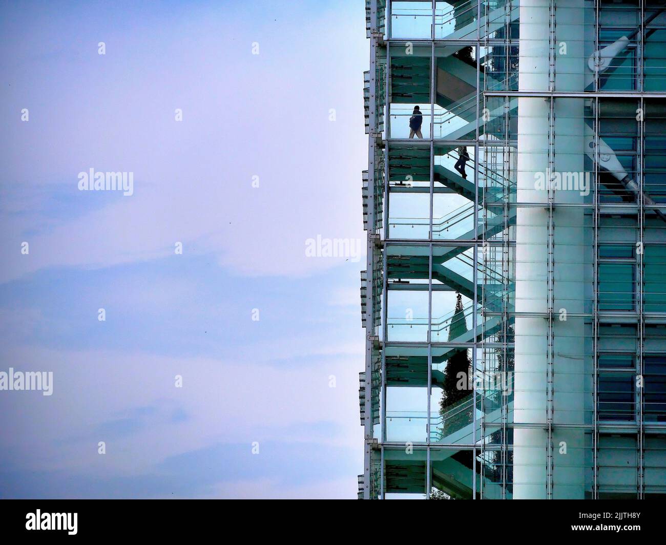Few men climbing the skyscraper stairs with glass windows Stock Photo ...