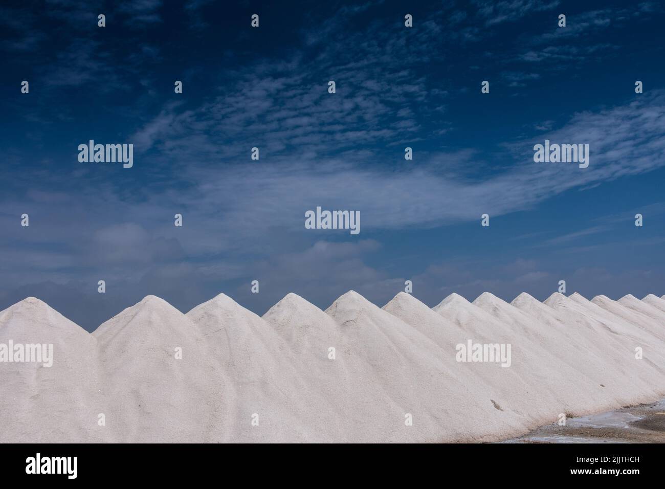 hills of naturally produced sea salt in a seawater saline Stock Photo ...