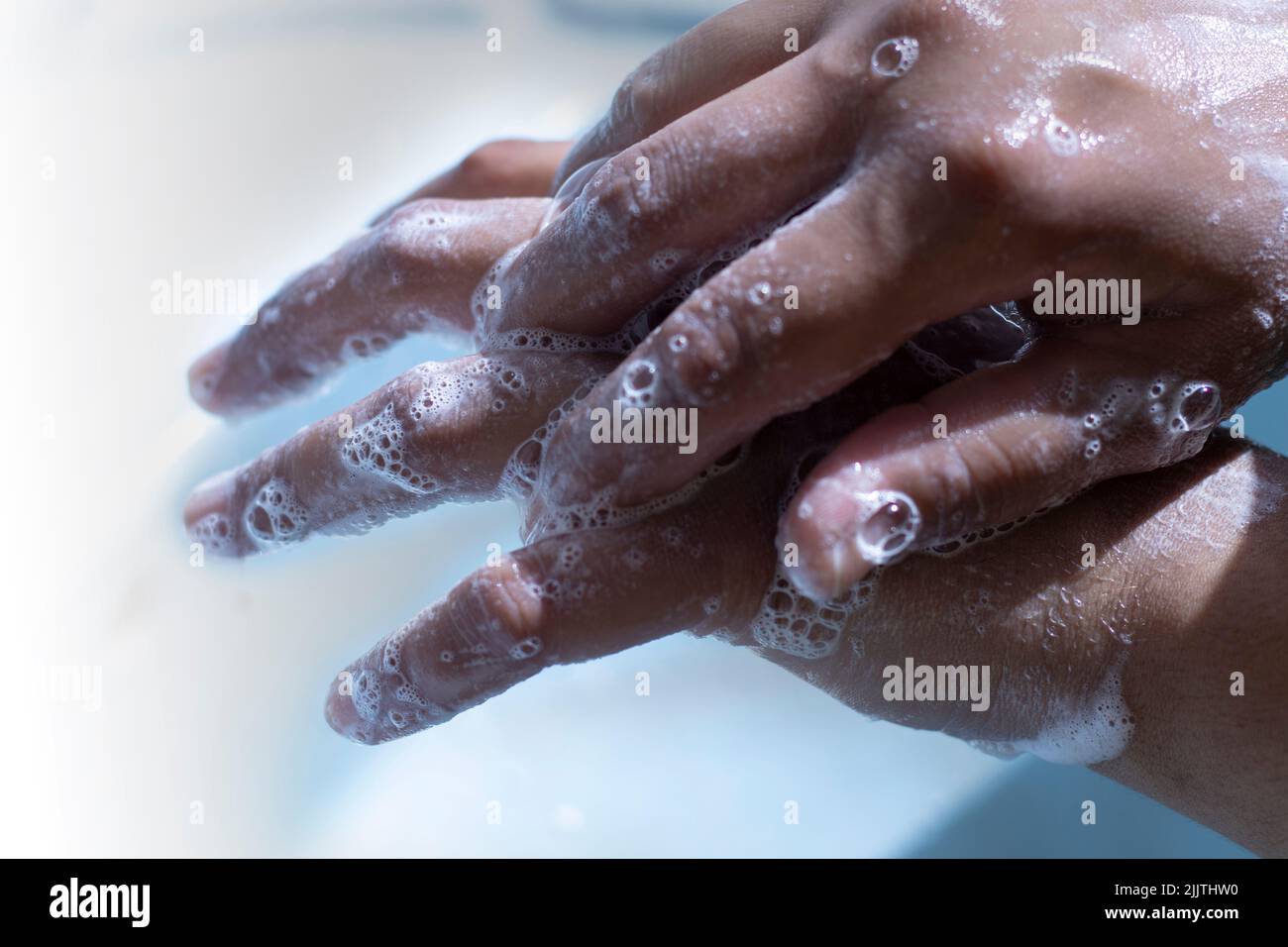 A closeup shot of women's hands who washes with soap under water Stock ...