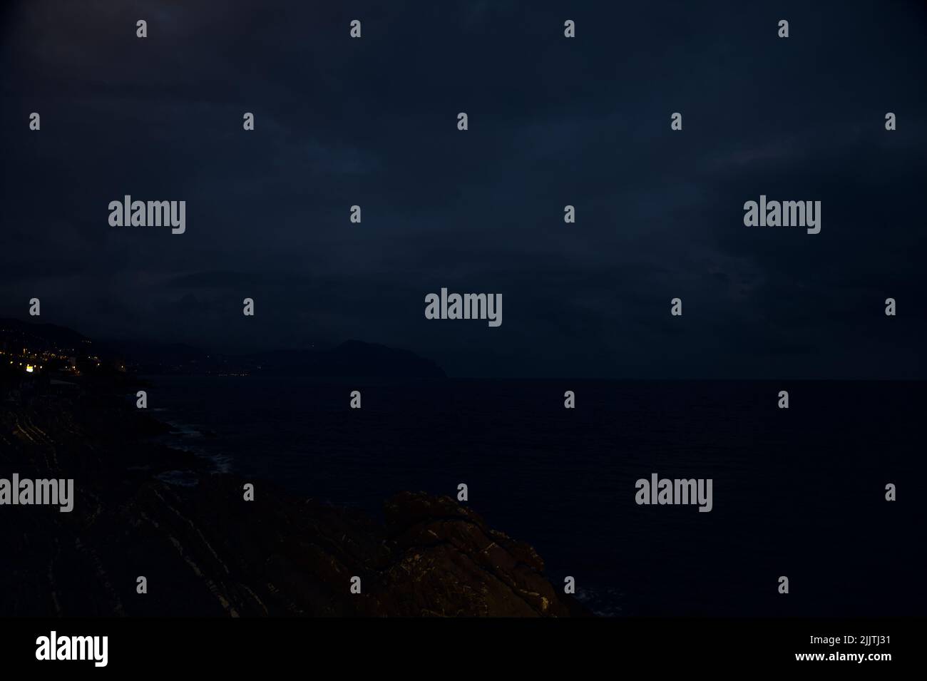 Panoramic walk lit by street lights at dusk Stock Photo - Alamy