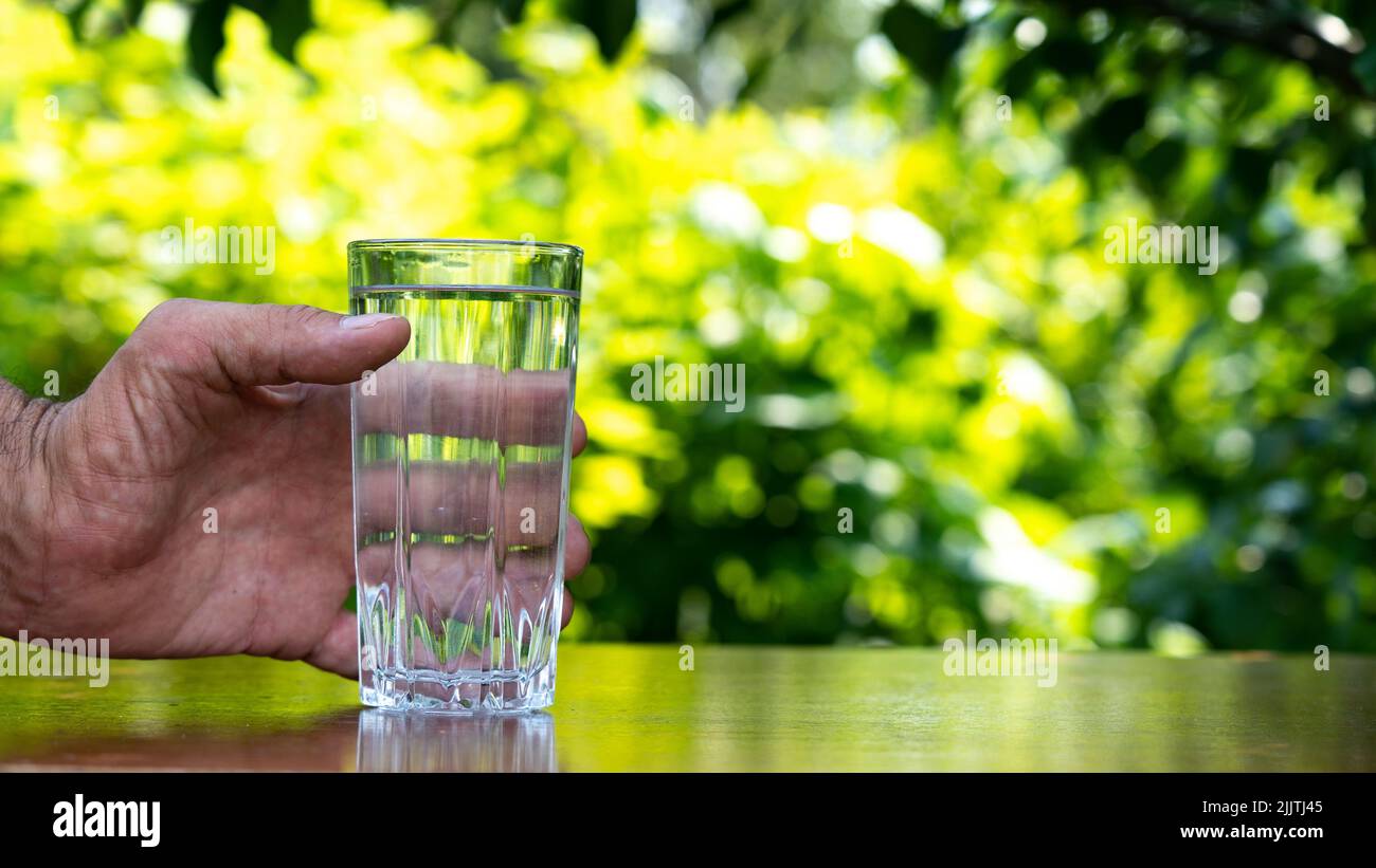 Take a glass of water Stock Photo - Alamy