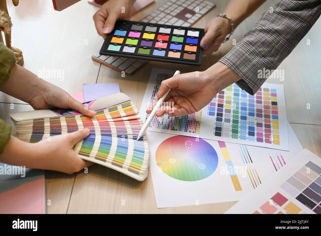 Team of creative designer brainstorming, discussing ideas for design ...