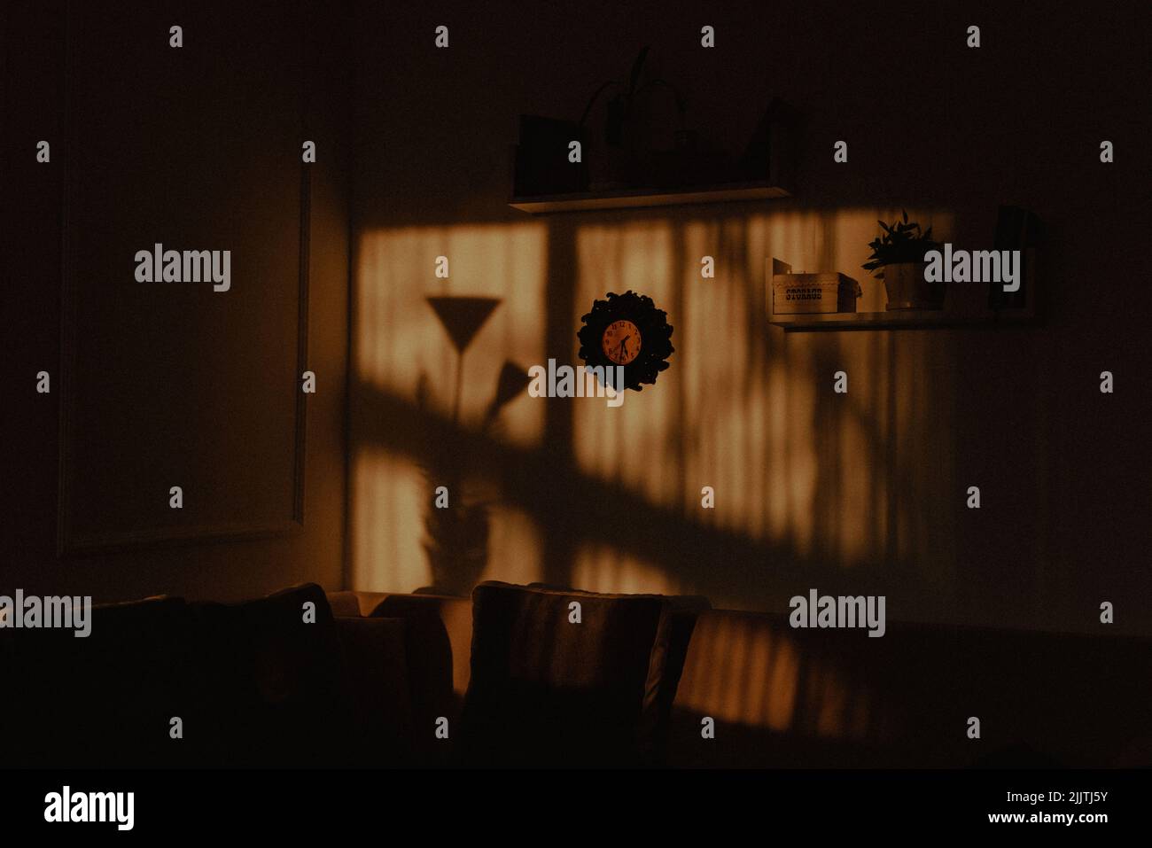 The shadows on a wall at home at sunset Stock Photo - Alamy