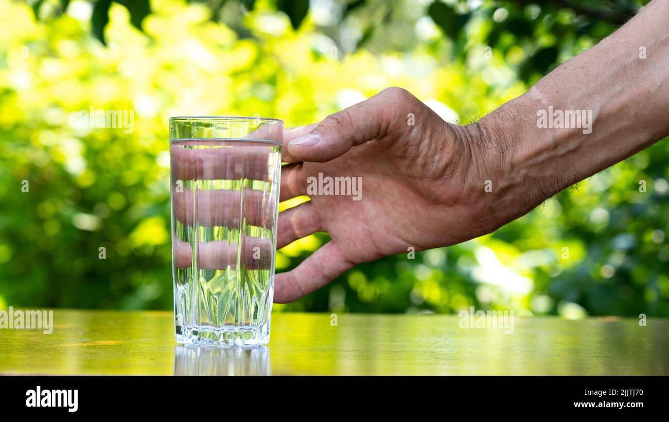 Take a glass of water Stock Photo - Alamy