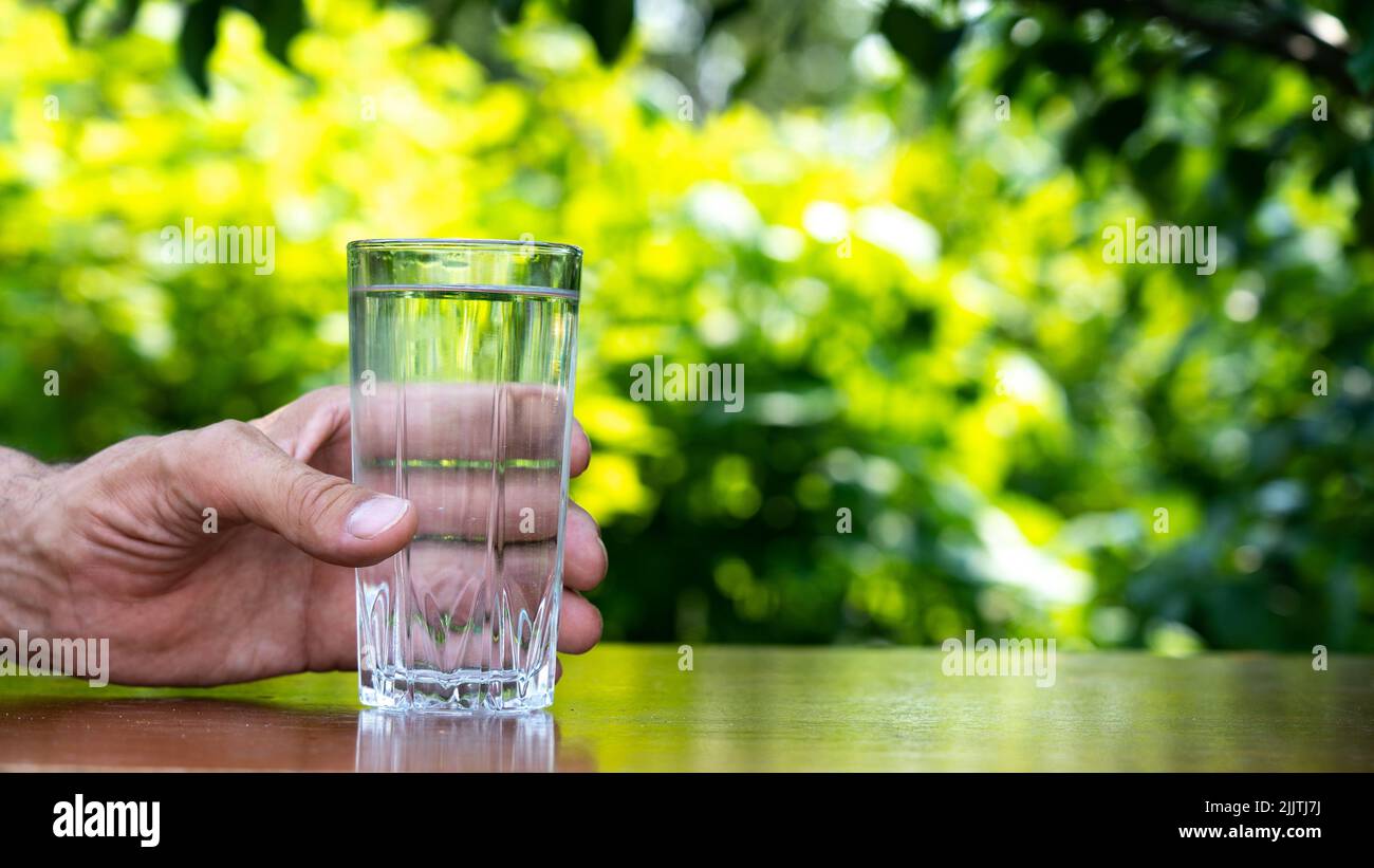 Take a glass of water Stock Photo - Alamy