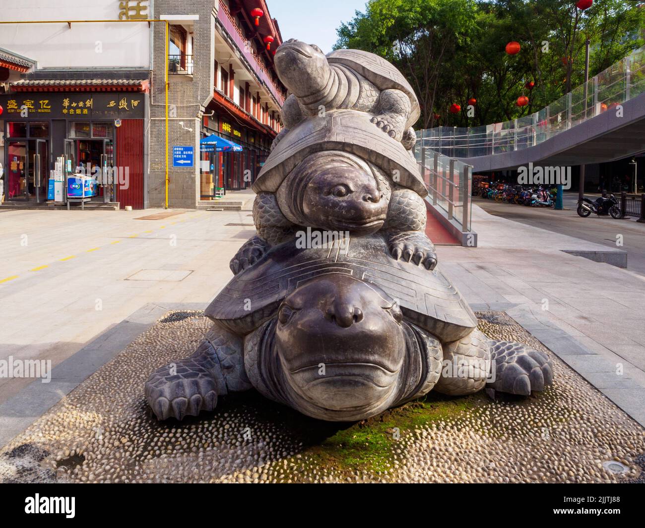 Xi'An, China - June 5, 2022: Metallic sculpture of three turtles in a ...