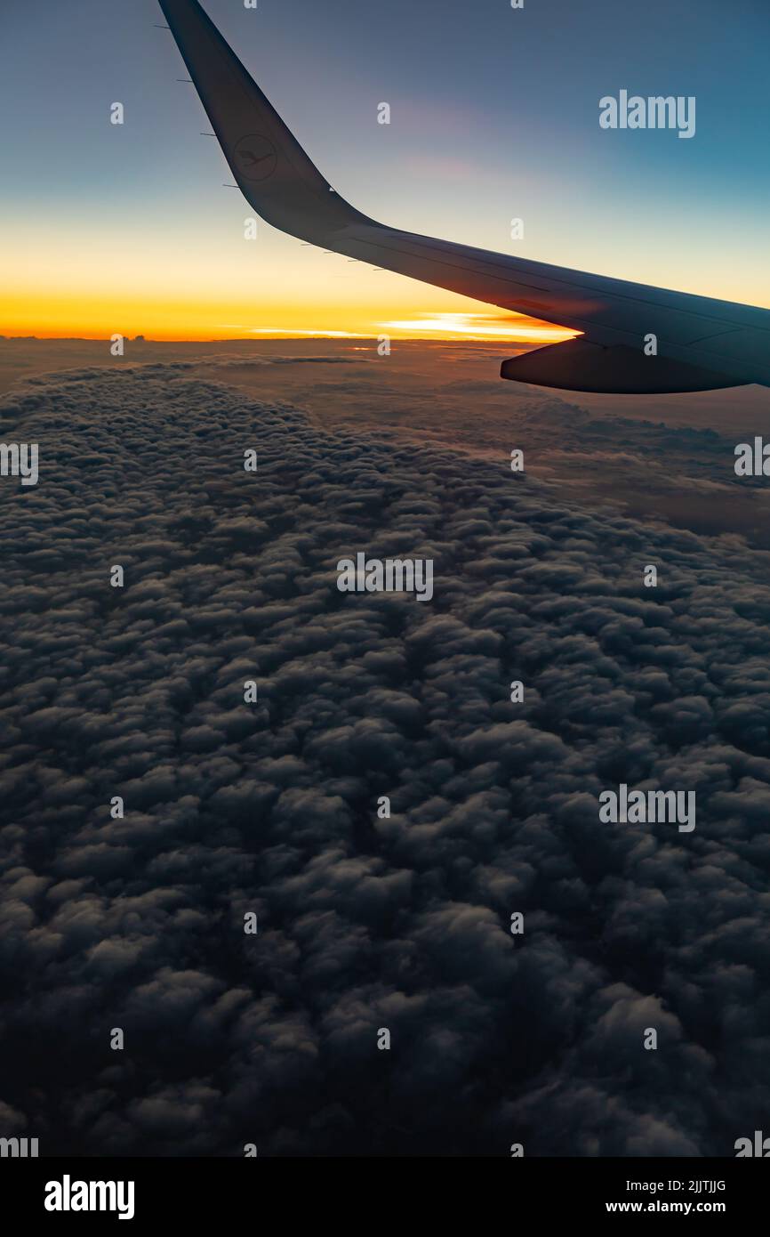 A beautiful shot from an airplane's window of its wing during sunset ...