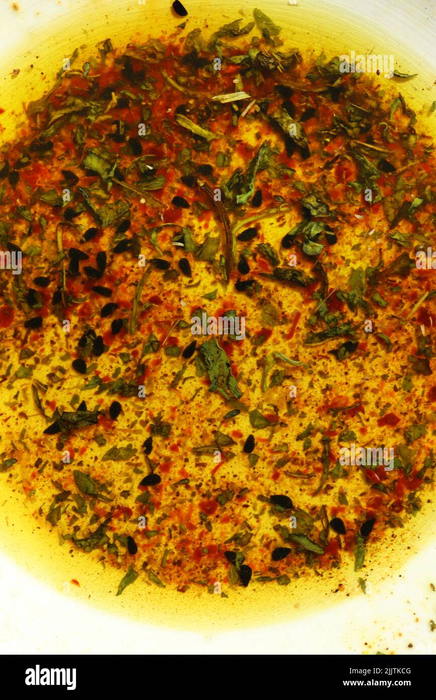 olive oil and various spices in the plate Stock Photo - Alamy