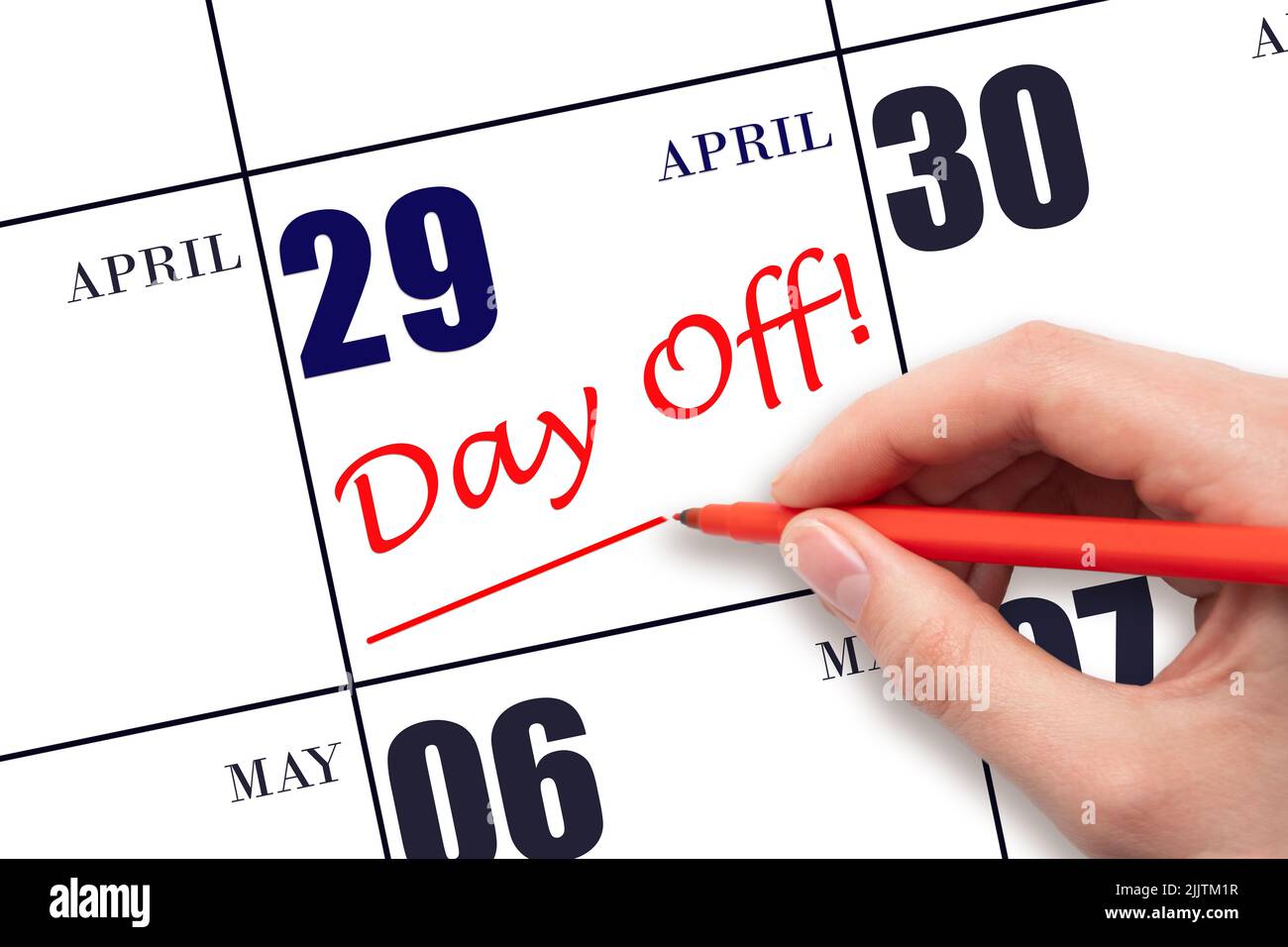 29th day of April. Hand writing text DAY OFF and drawing a line on ...