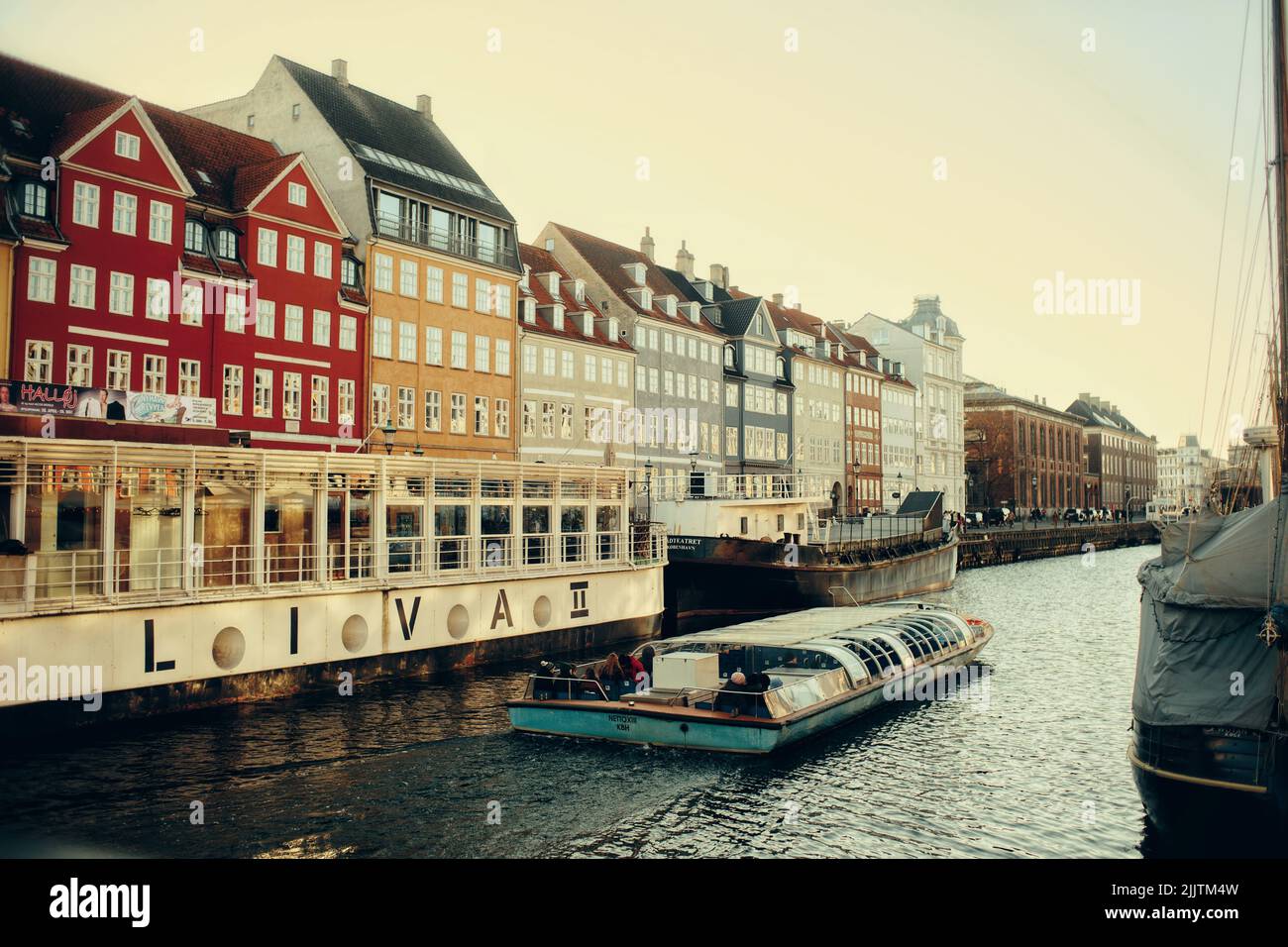 The exterior design of colorful houses with boat in the river in ...