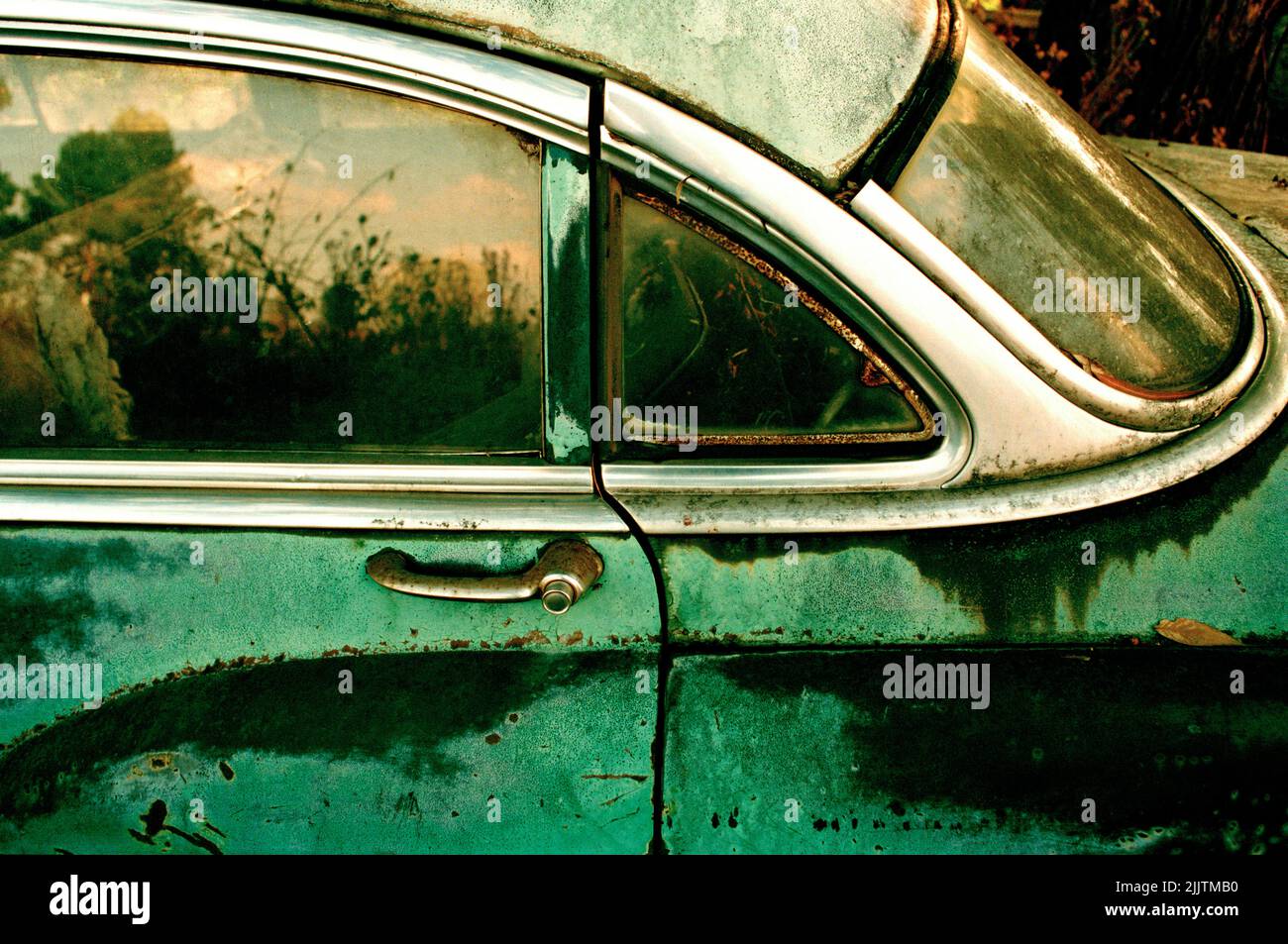 An old retro vintage classic weathered green car detail Stock Photo - Alamy