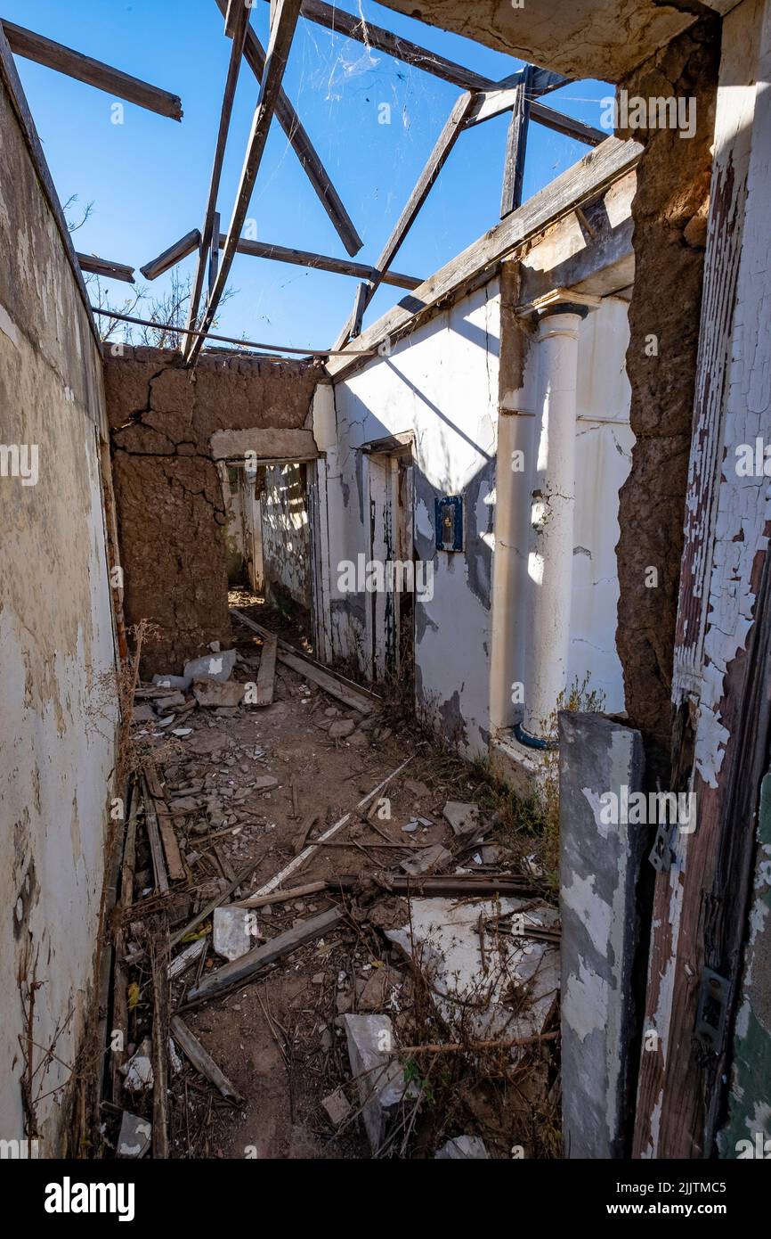 An inside view of an old abandoned weathered building with cracked ...