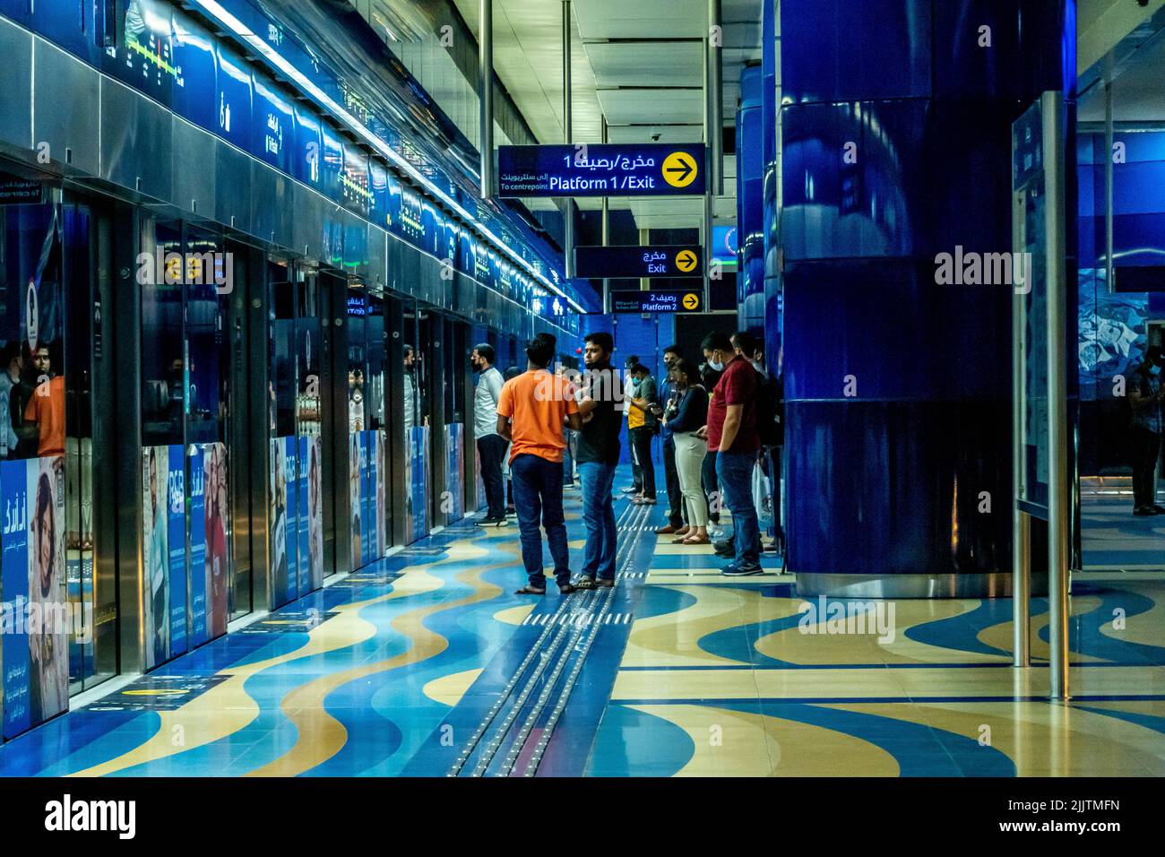 The passengers waiting for the train to arrive at the Dubai Metro in ...