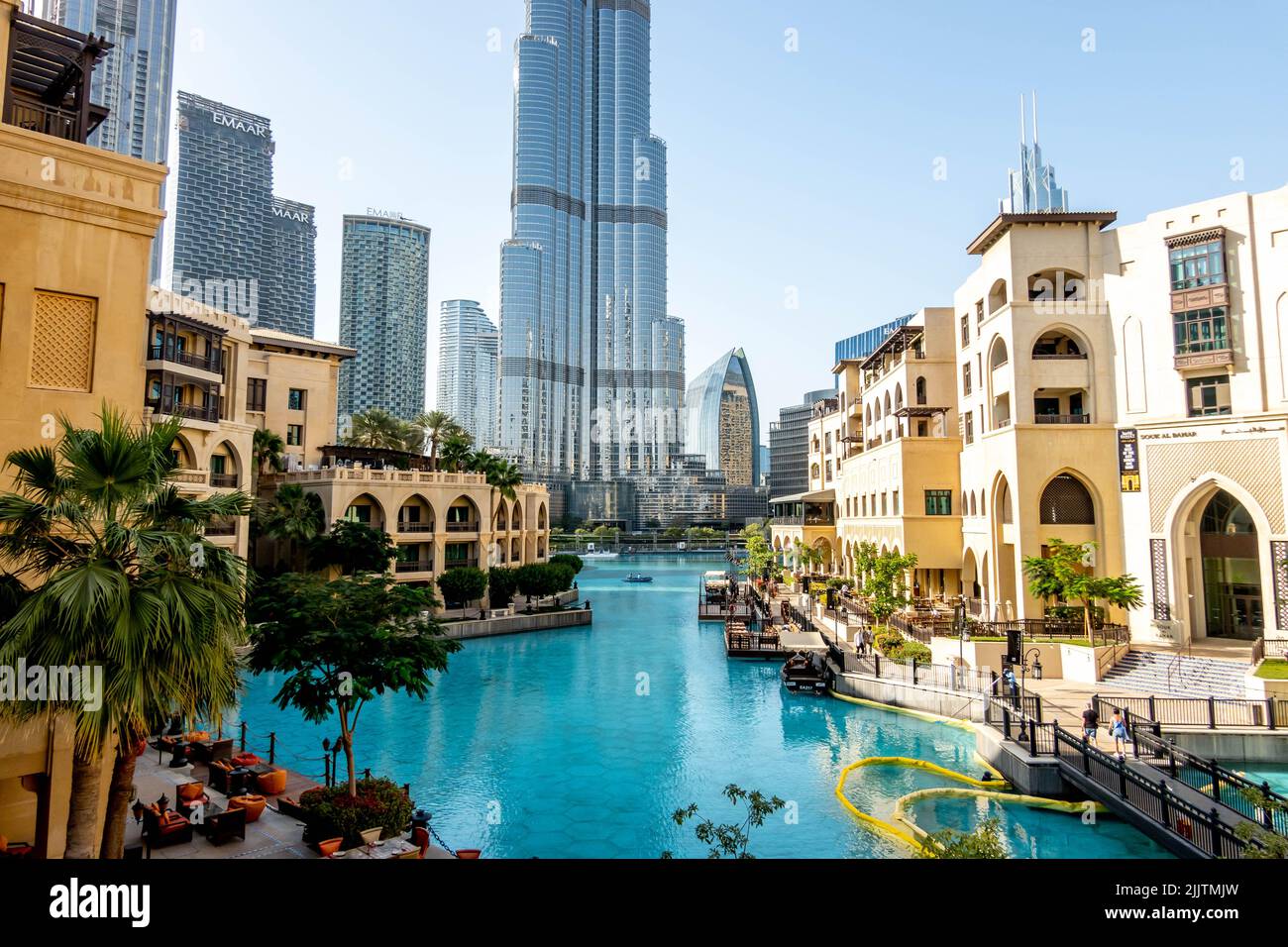 The iconic Burj Khalifa building with city in the foreground in Dubai ...