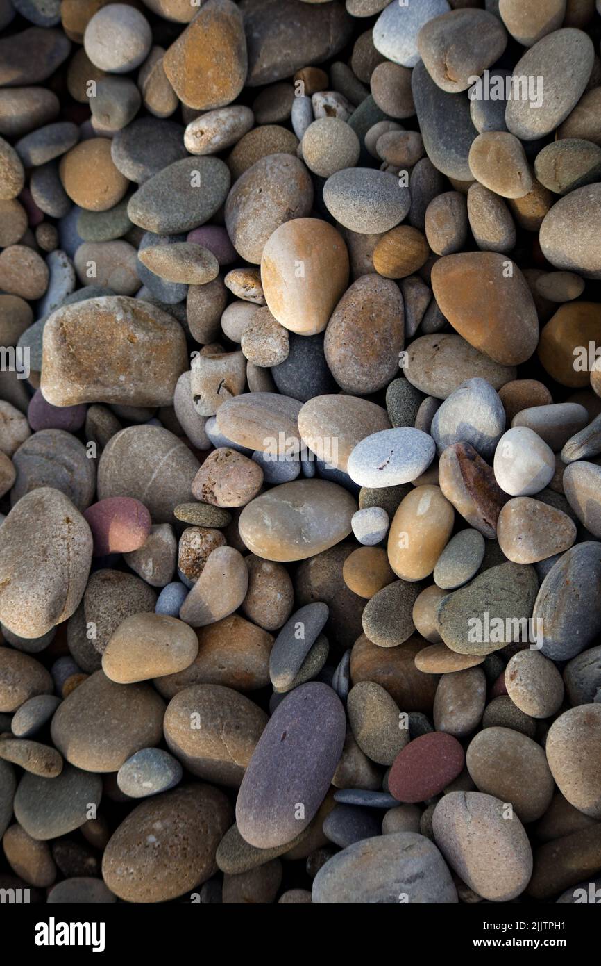 A vertical shot of small stones on Pebble Beach, California, USA Stock ...