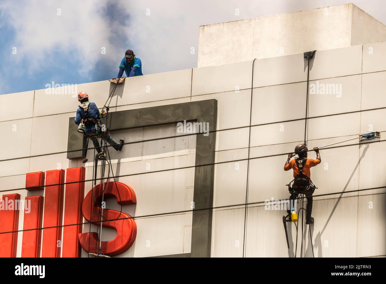 Men Cleaning a High-Rise Building Stock Photo - Alamy