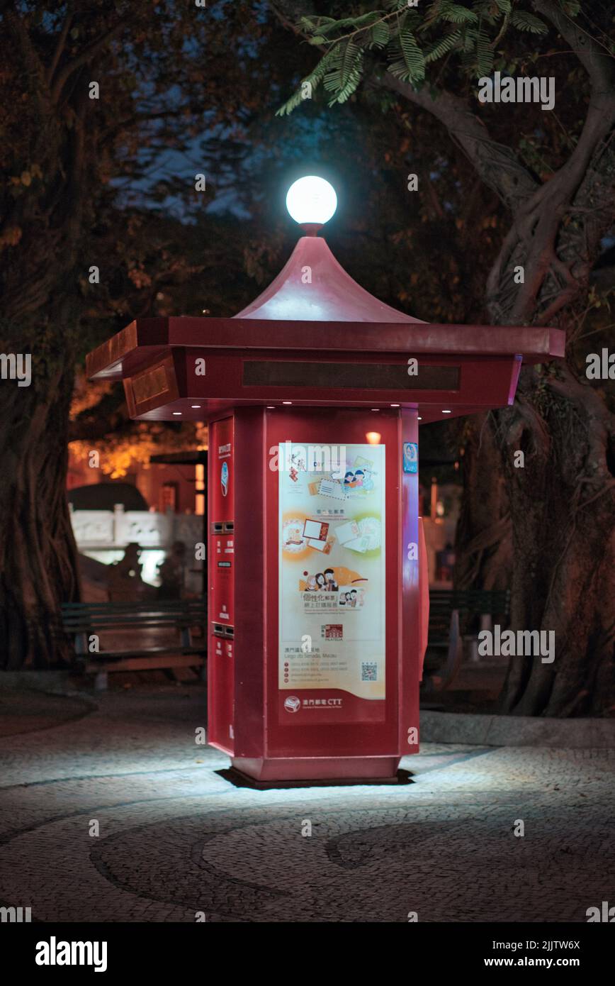 A vertical night shot of cute red mailbox in Macau, China Stock Photo ...