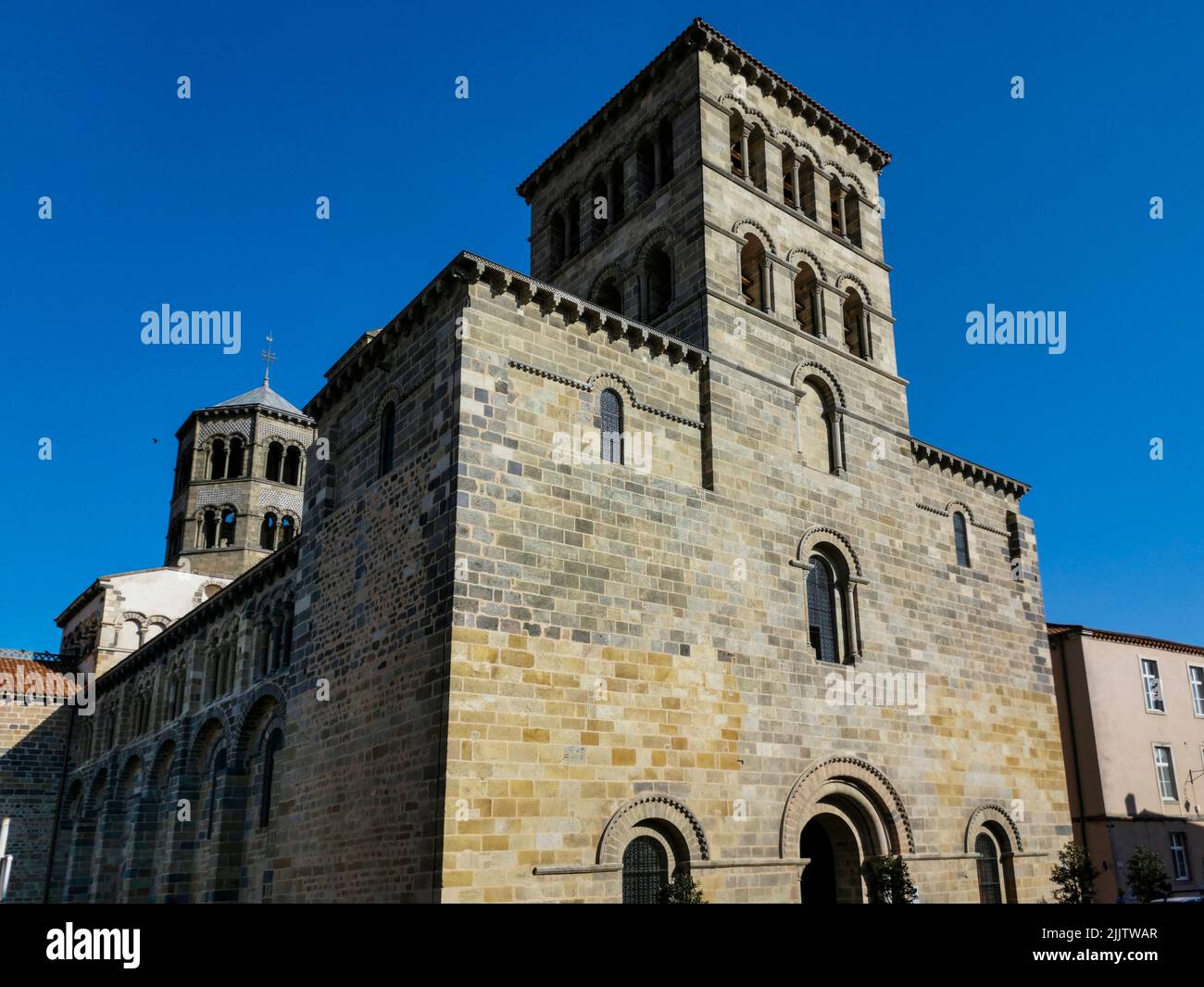 A low angle shot of the abbey church of Saint-Austremoine in Issoire ...