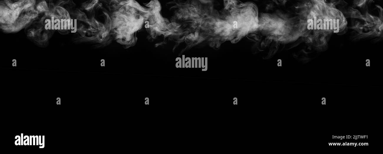 Panorama of steam, smoke, gas isolated on a black background. Swirling ...
