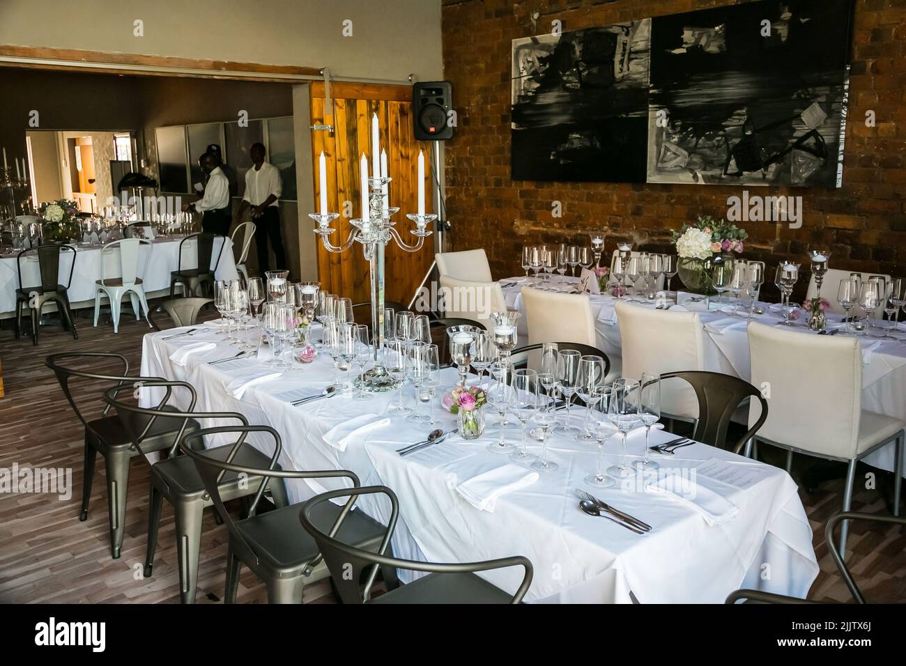 The interior of a quaint restaurant bistro decorated with candles and ...