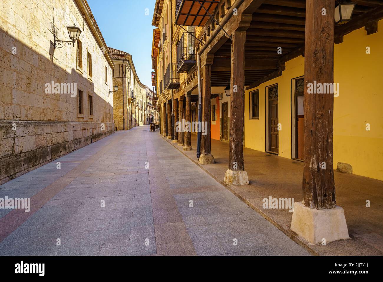 Arcades of old buildings fastened with very old wooden columns in the ...