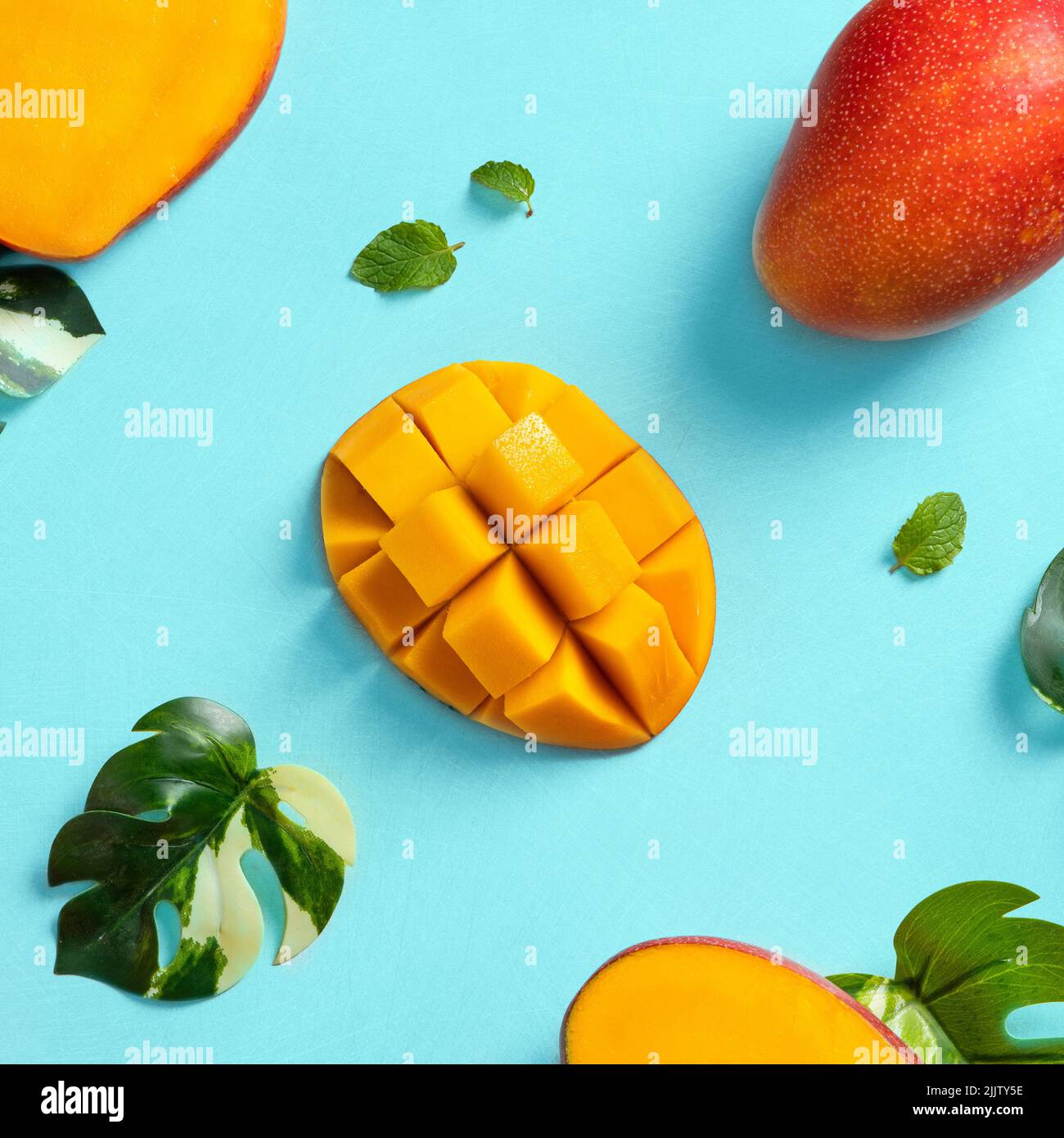 Mango background design concept. Top view of diced fresh mango fruit ...