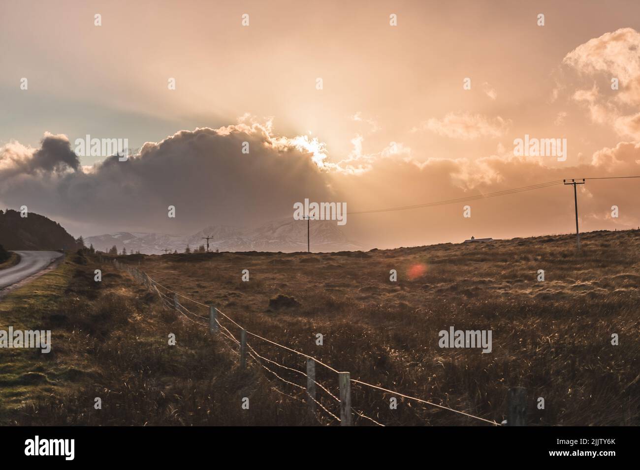 The sun peaking out from behind the clouds in the Scottish highlands ...