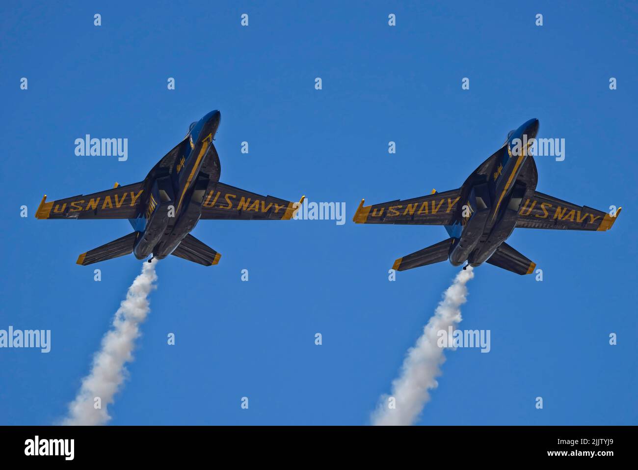 A low angle closeup of two Navy Blue Angels in flight at Huntington ...