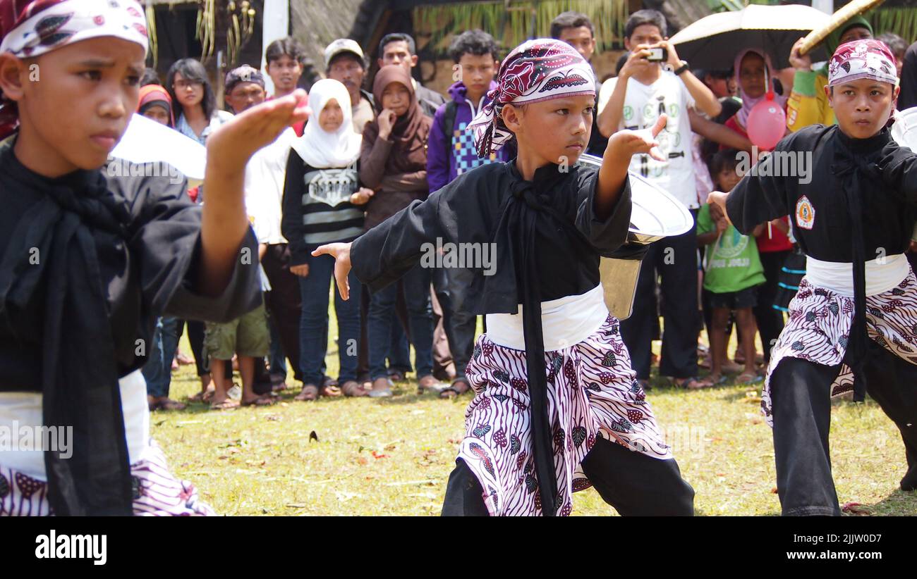 A closeup of young boys performing traditional dances combined with ...