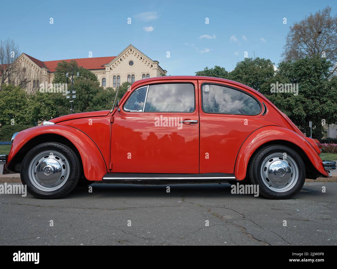 A side view of a classic old red VW Beetle car Stock Photo - Alamy