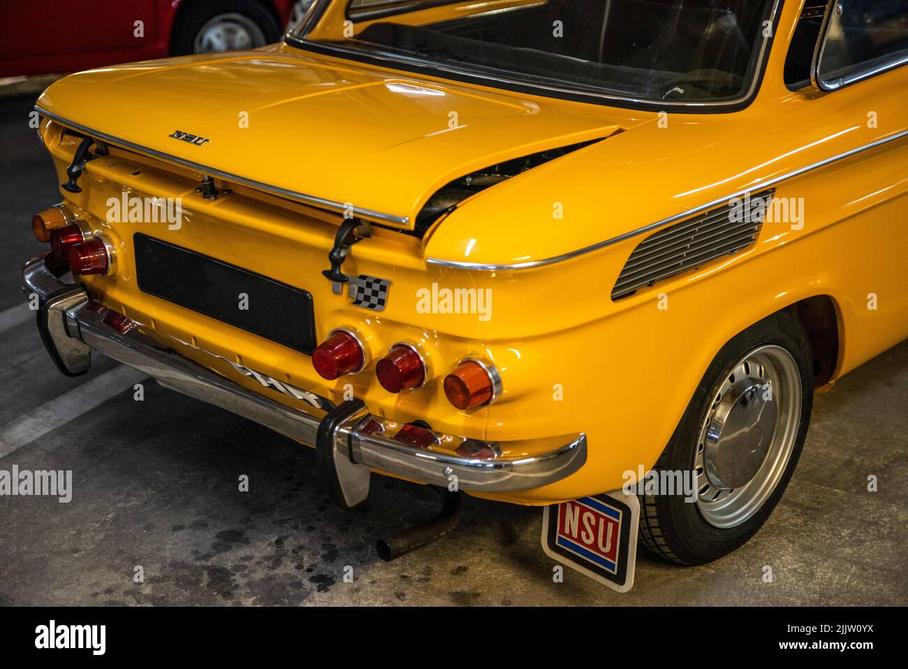 A close-up of the back side of the yellow car model NSU Prinz 1000 ...