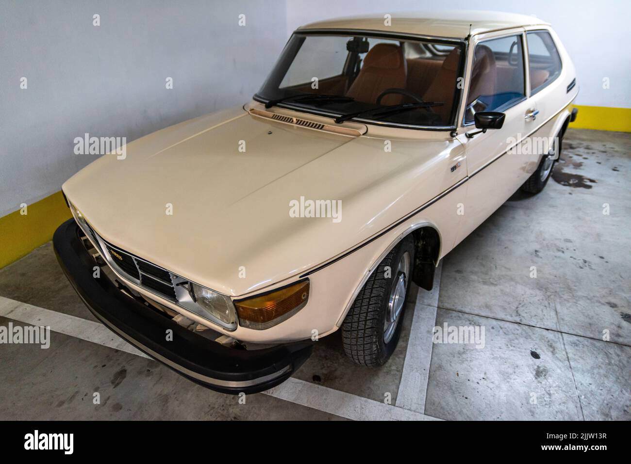 An angle shot of a Saab 99 L model beige car Stock Photo - Alamy
