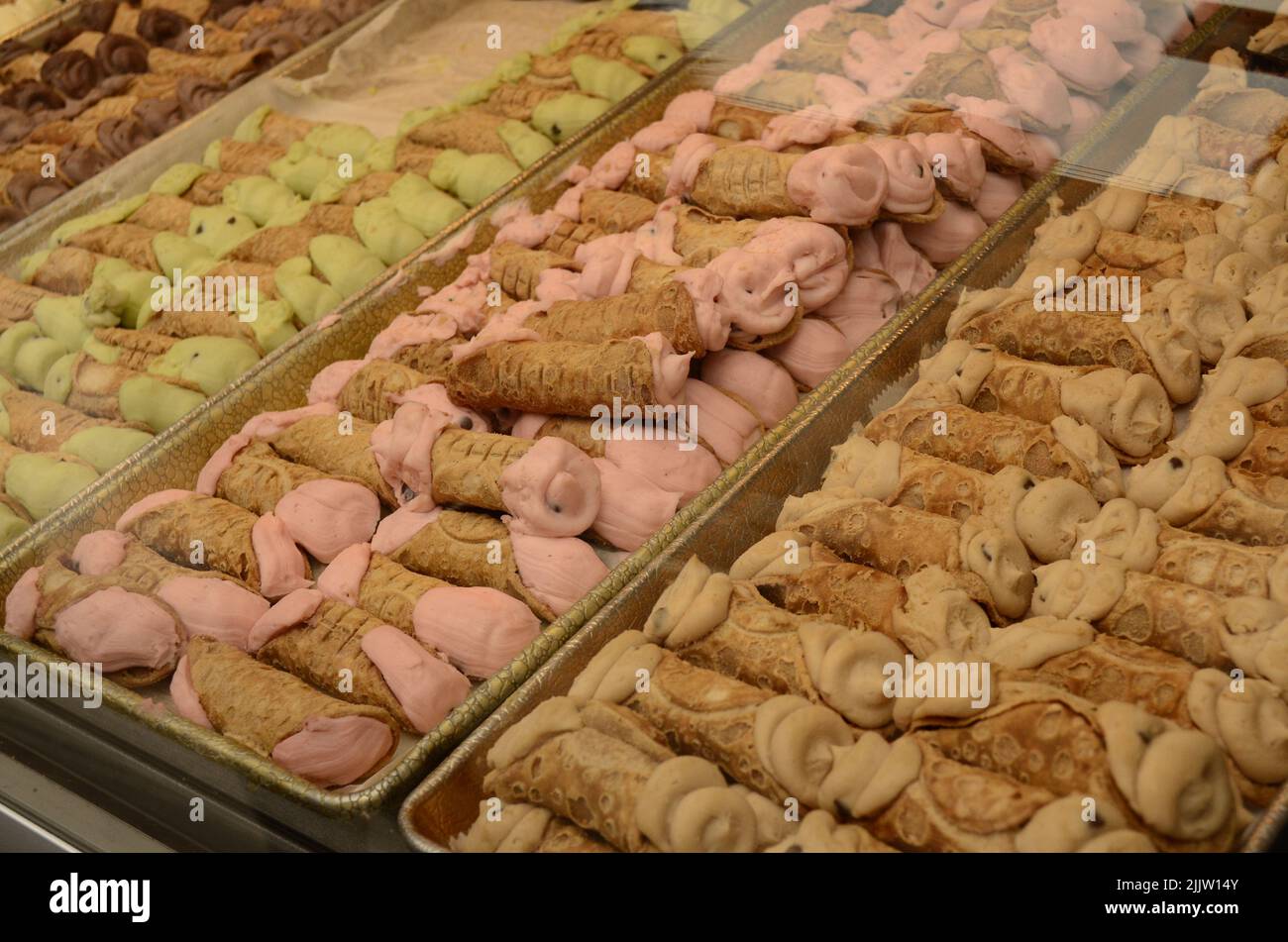 A closeup shot of cannolis with different fillings on display Stock ...