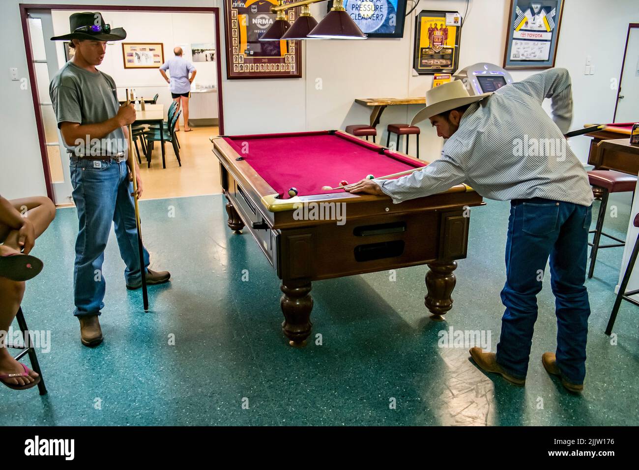 Two young cowboys in town for the annual camp draft competition playing ...