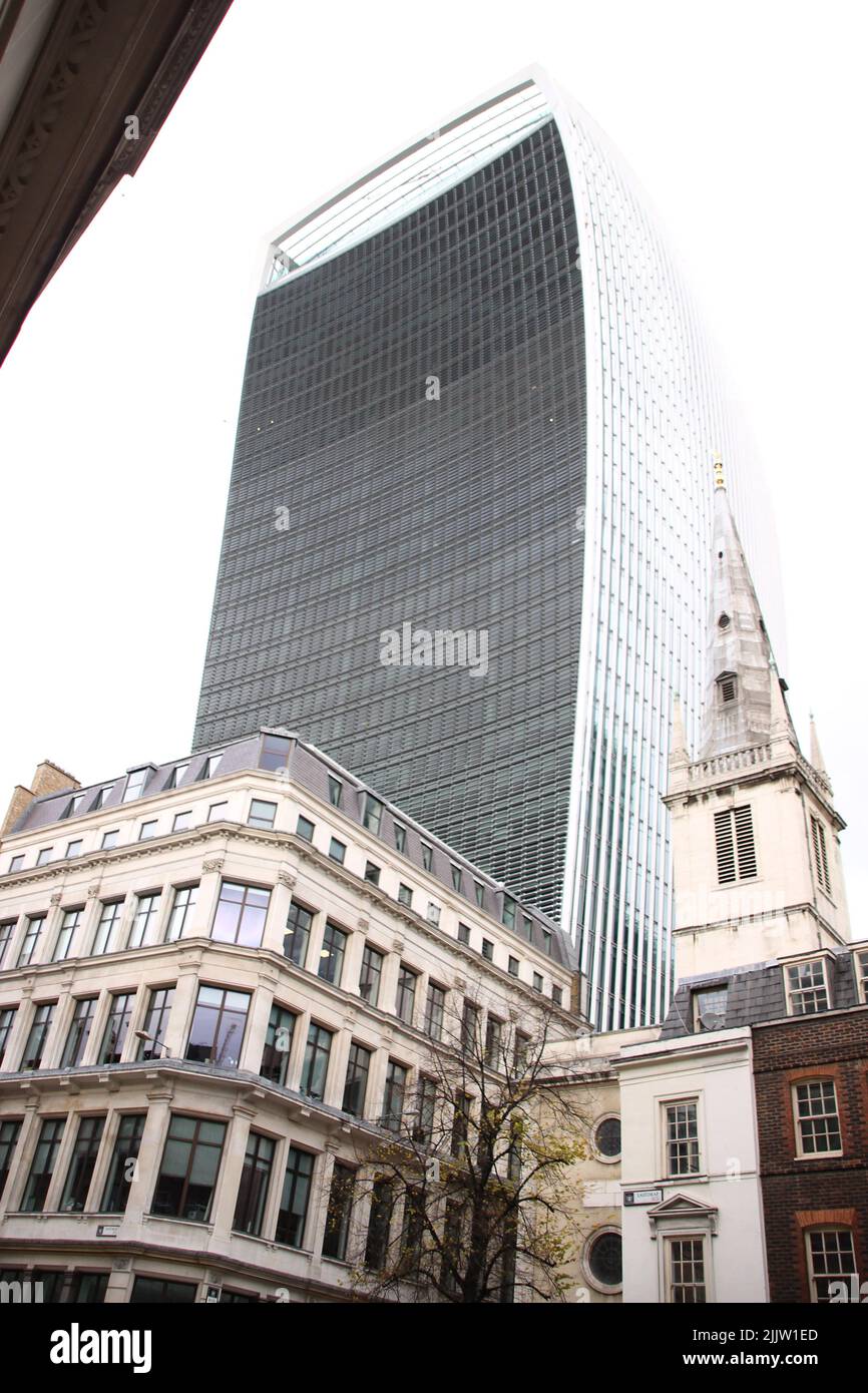 A modern high-rise beside aged buildings in London, the UK Stock Photo ...