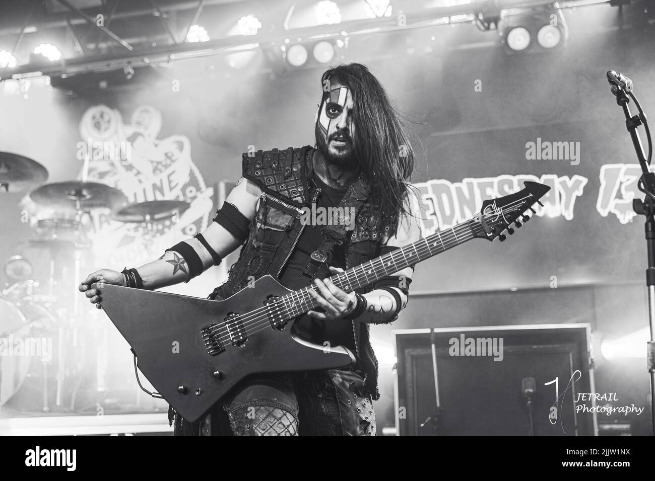 A grayscale shot of the Roman Surman Wednesday playing guitar in the ...
