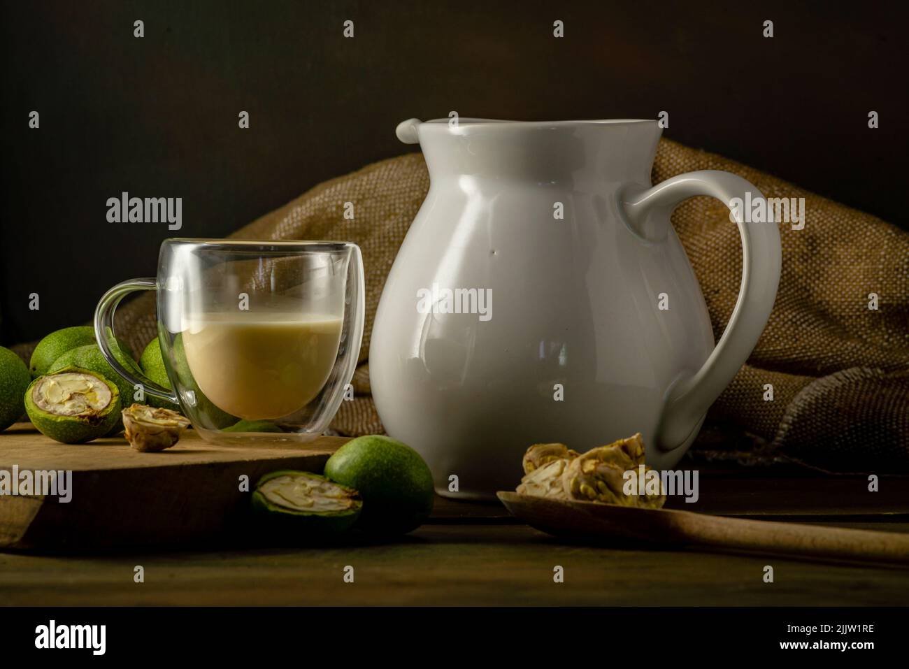 green walnut kernels leaves wooden table oil nuts unripe husks healthy ...