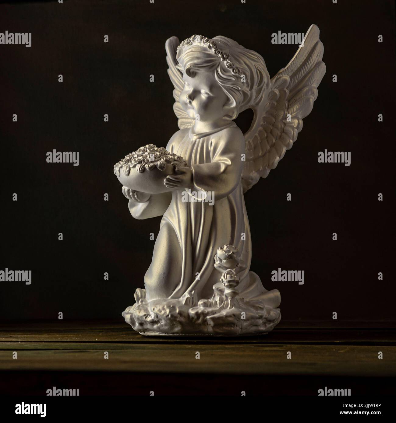 Guardian angel isolated black background statue copy space beautiful ...