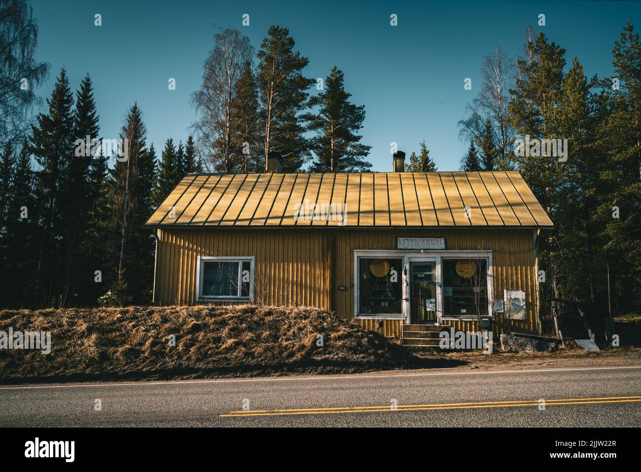 An abandoned market on the background of pine trees in the village of ...