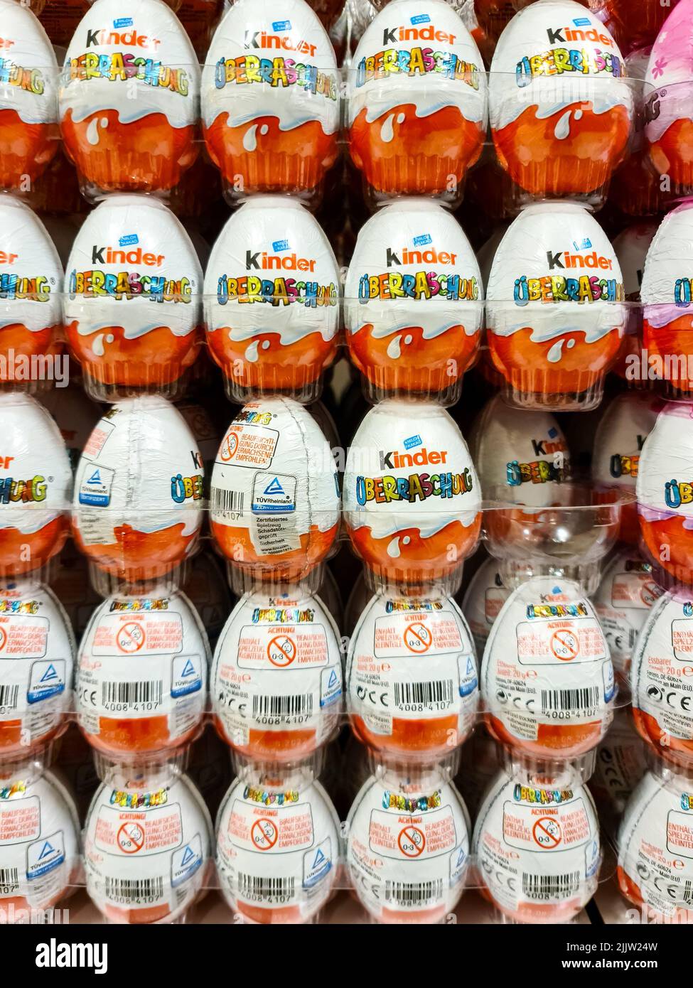 A vertical shot of Kinder brand chocolate surprise eggs in a ...