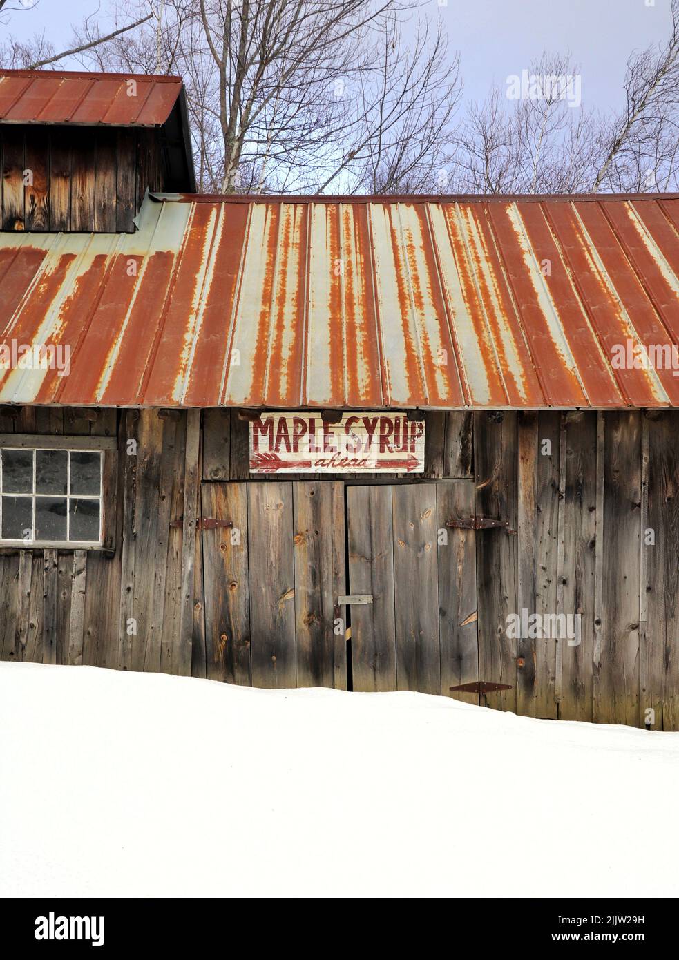 An old building used to make maple syrup in the snow in Vermont Stock ...