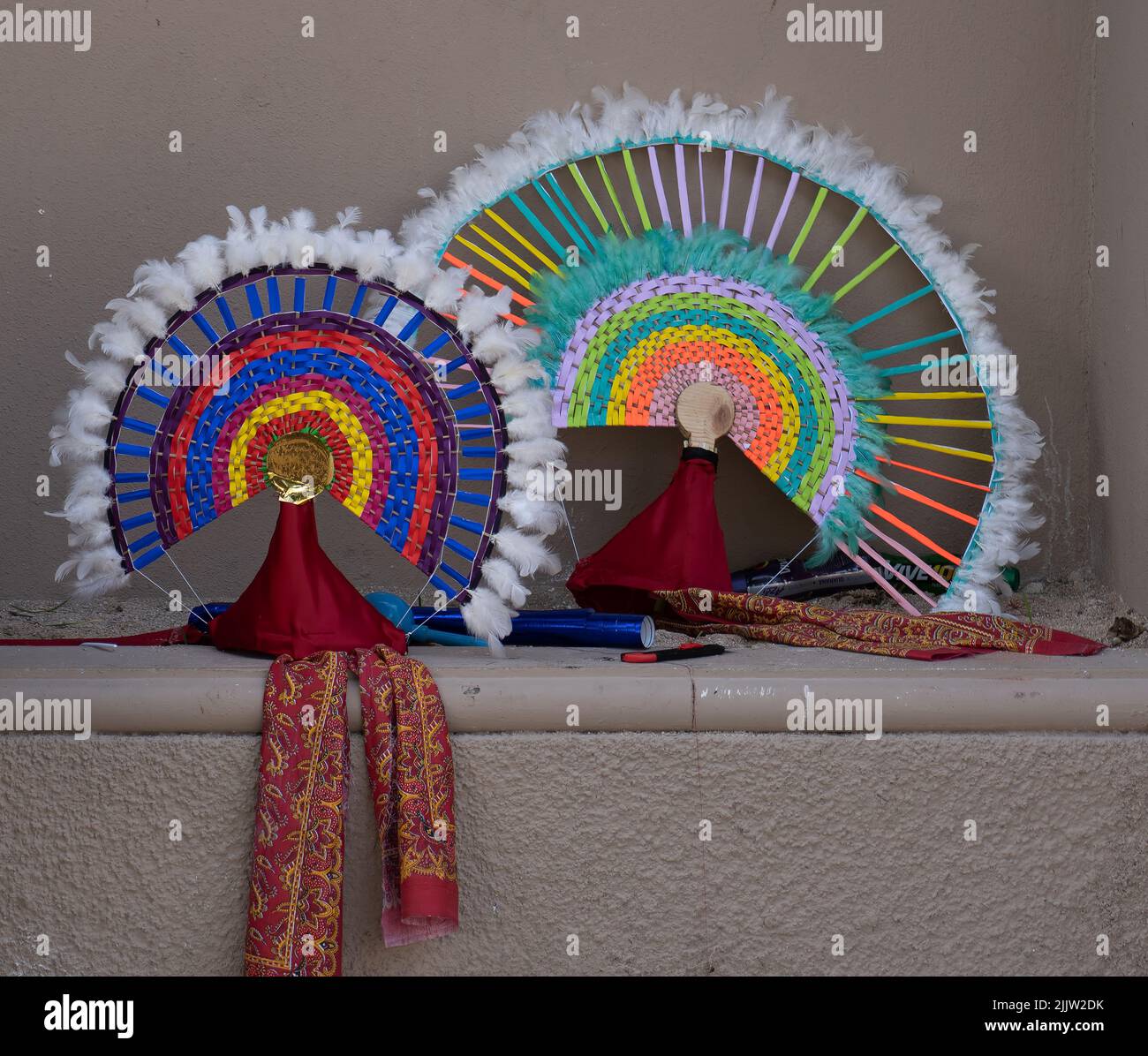 Some colorful ceremonial headdresses on the corner Stock Photo - Alamy