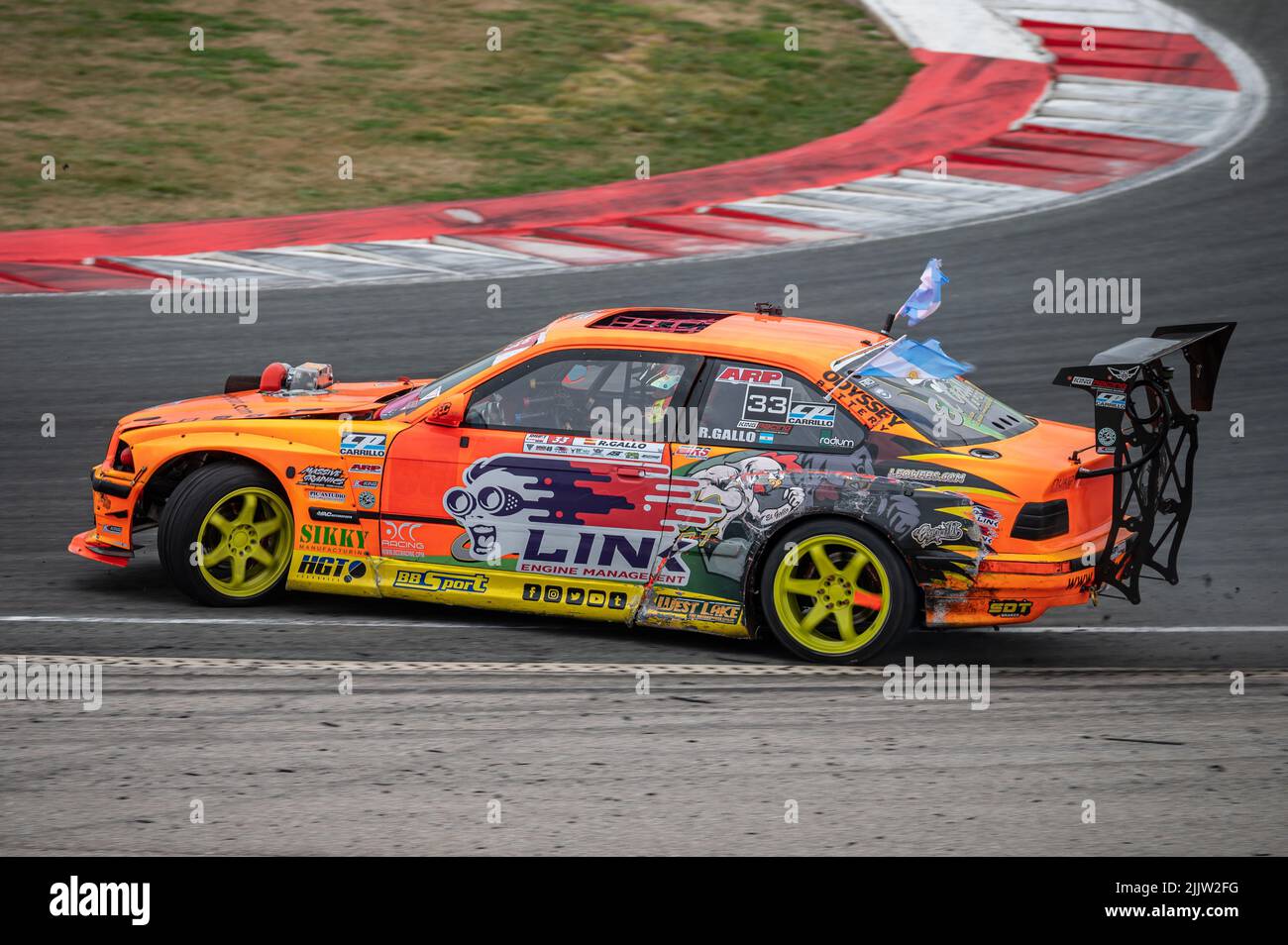 Orange Bmw E36 drift at the Navarra circuit Stock Photo - Alamy