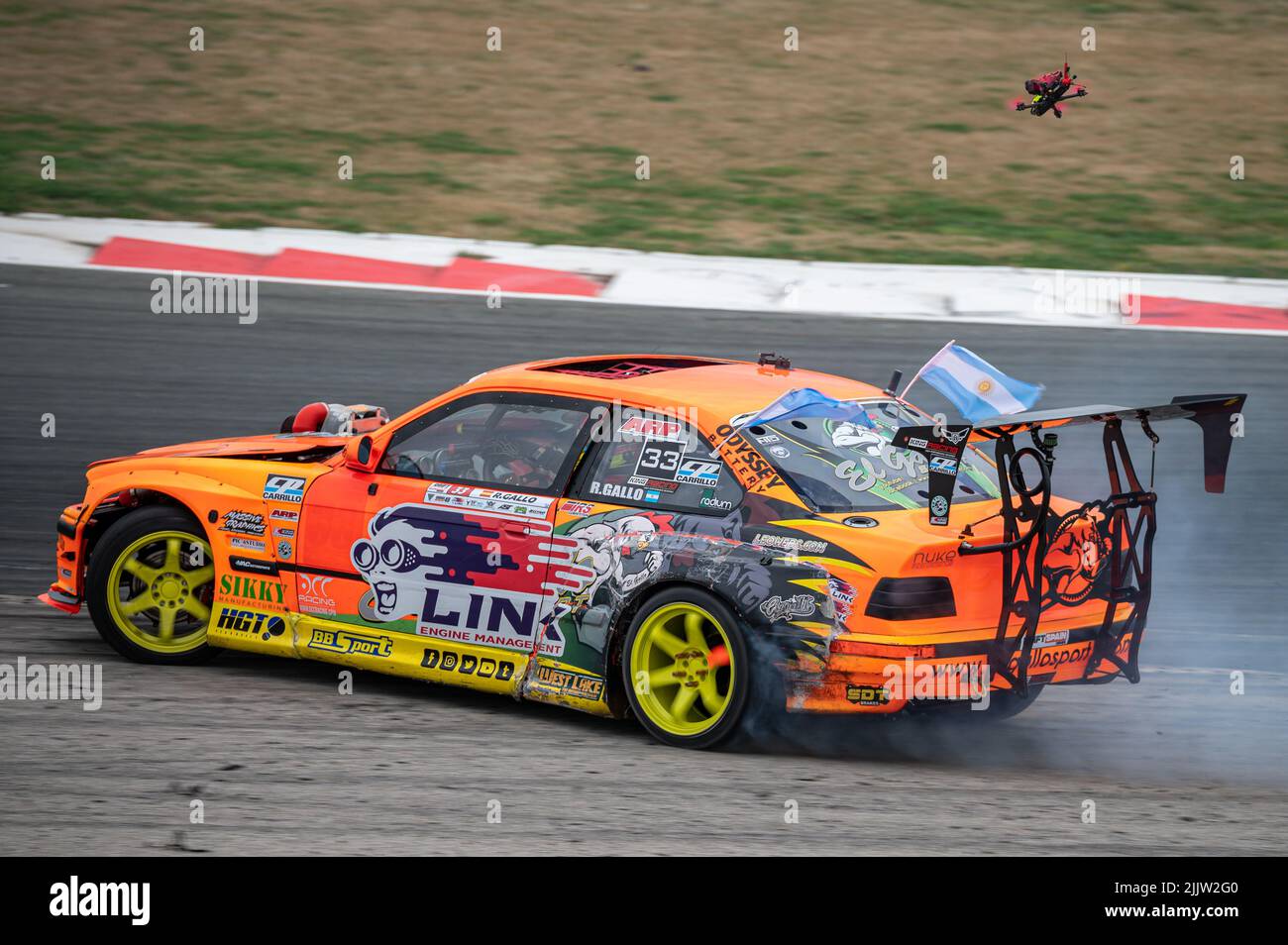 OrangeBmw E36 drift at the Navarra circuit Stock Photo - Alamy