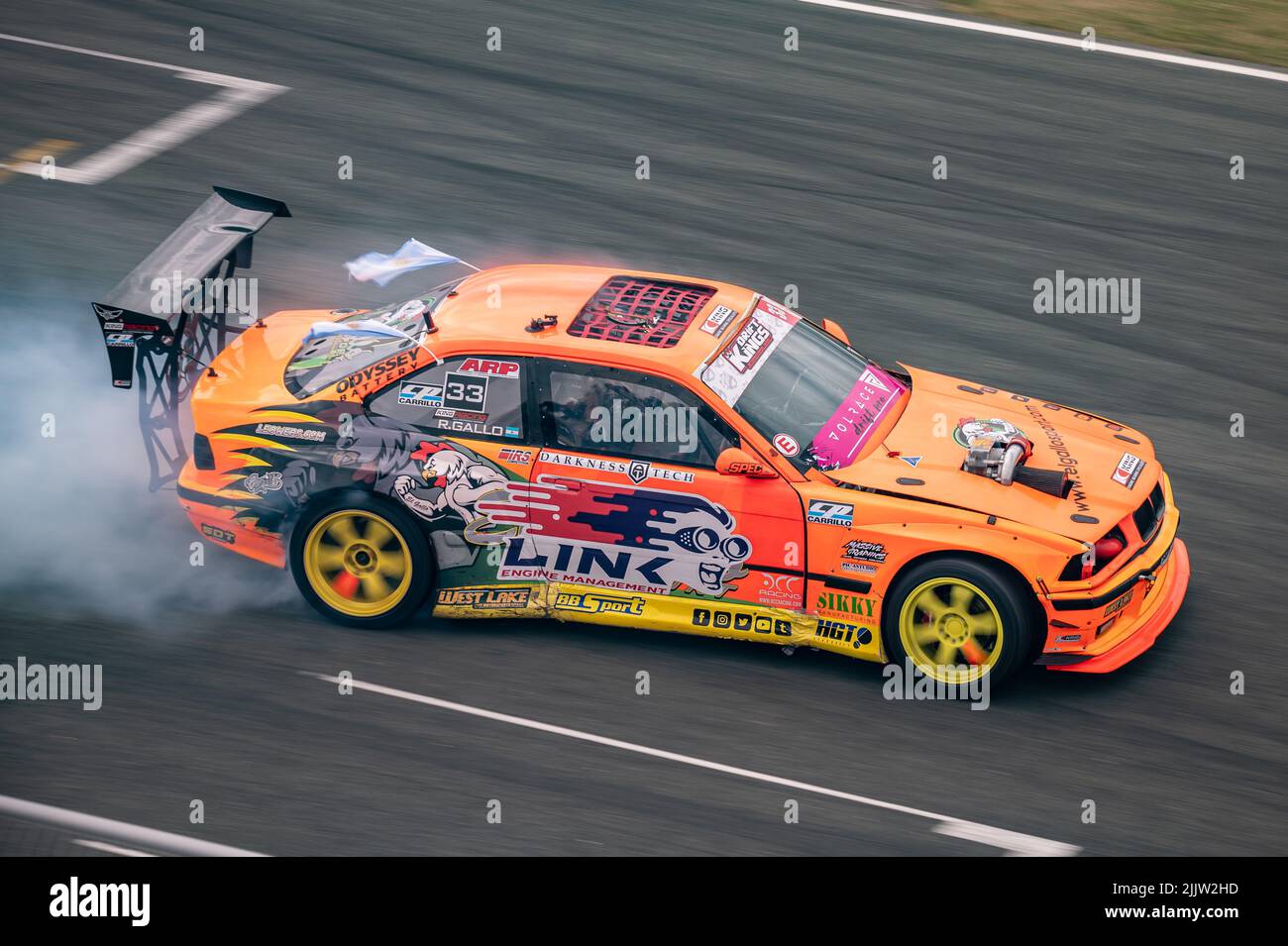Orange Bmw E36 drift at the Navarra circuit Stock Photo - Alamy